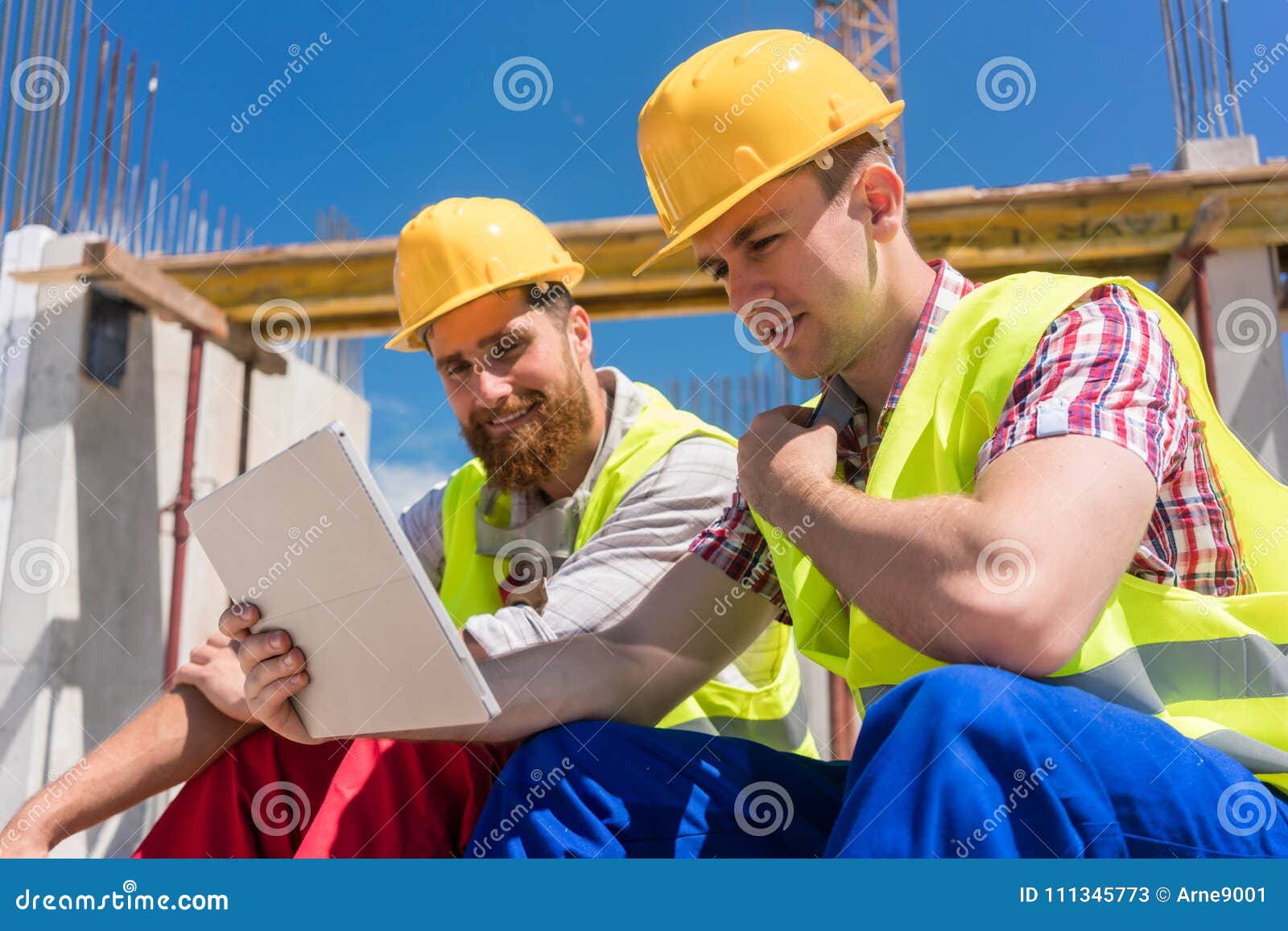 Two Workers Reading Online Information or Watching a Video Stock Image ...
