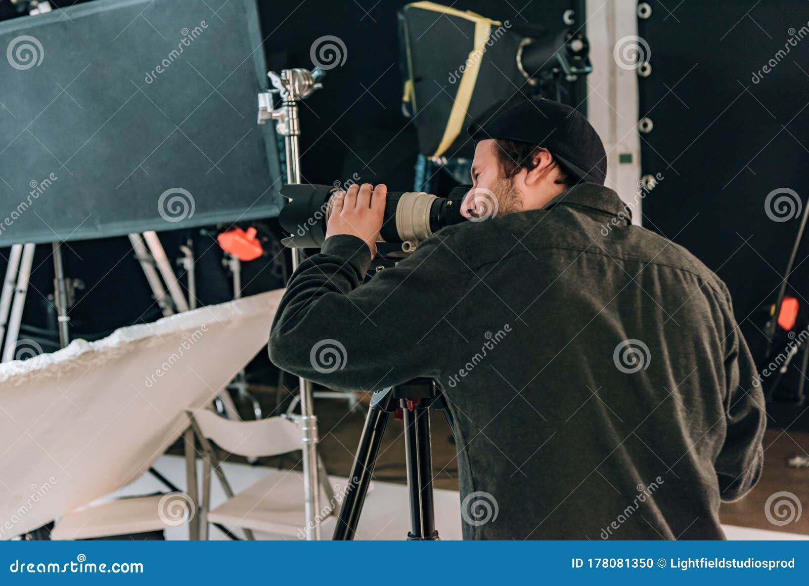 View of Videographer with Camera and Reflectors at Background Stock ...