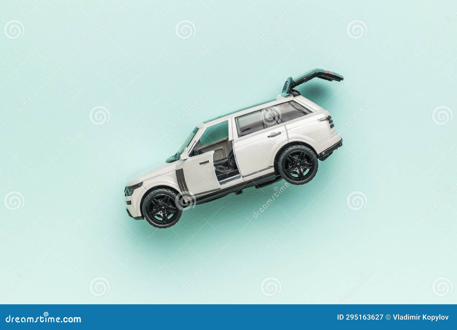 Side View of a White SUV with an Open Trunk on a Blue Background Stock ...