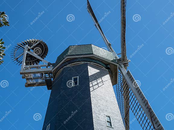 Side View of a Windmill Rotating on a Cloudless Day Stock Photo - Image ...