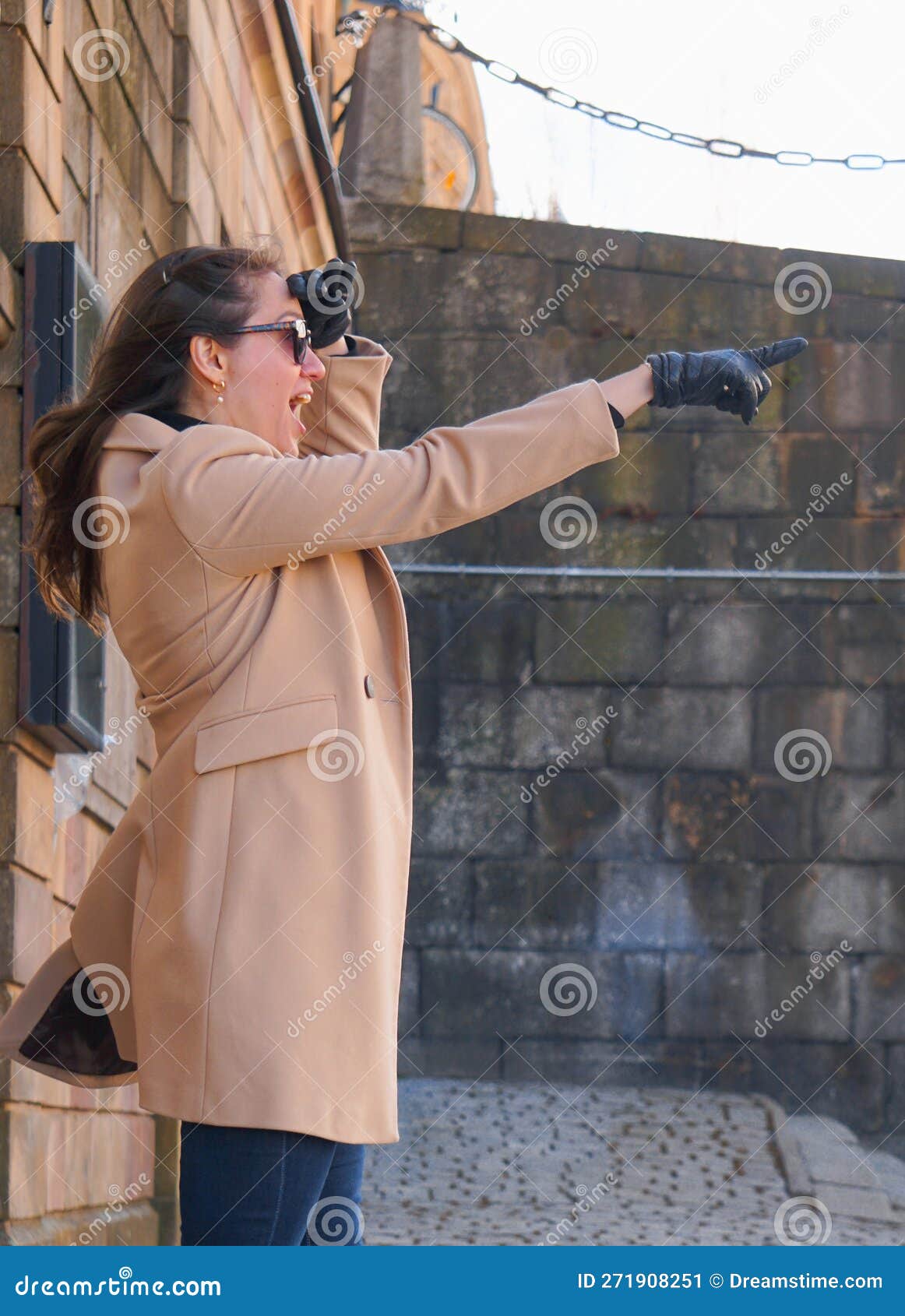 Side View of Woman Pointing and Smiling Stock Image - Image of looking ...