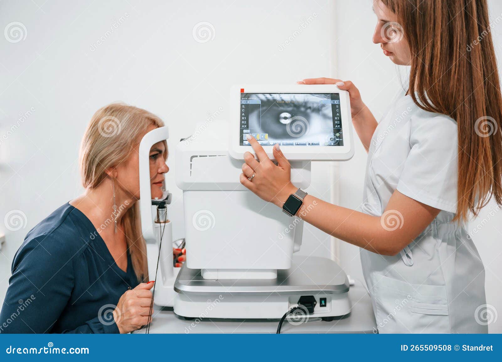 Side View. Woman`s Vision is Tested by Clinic Worker that Using Special ...
