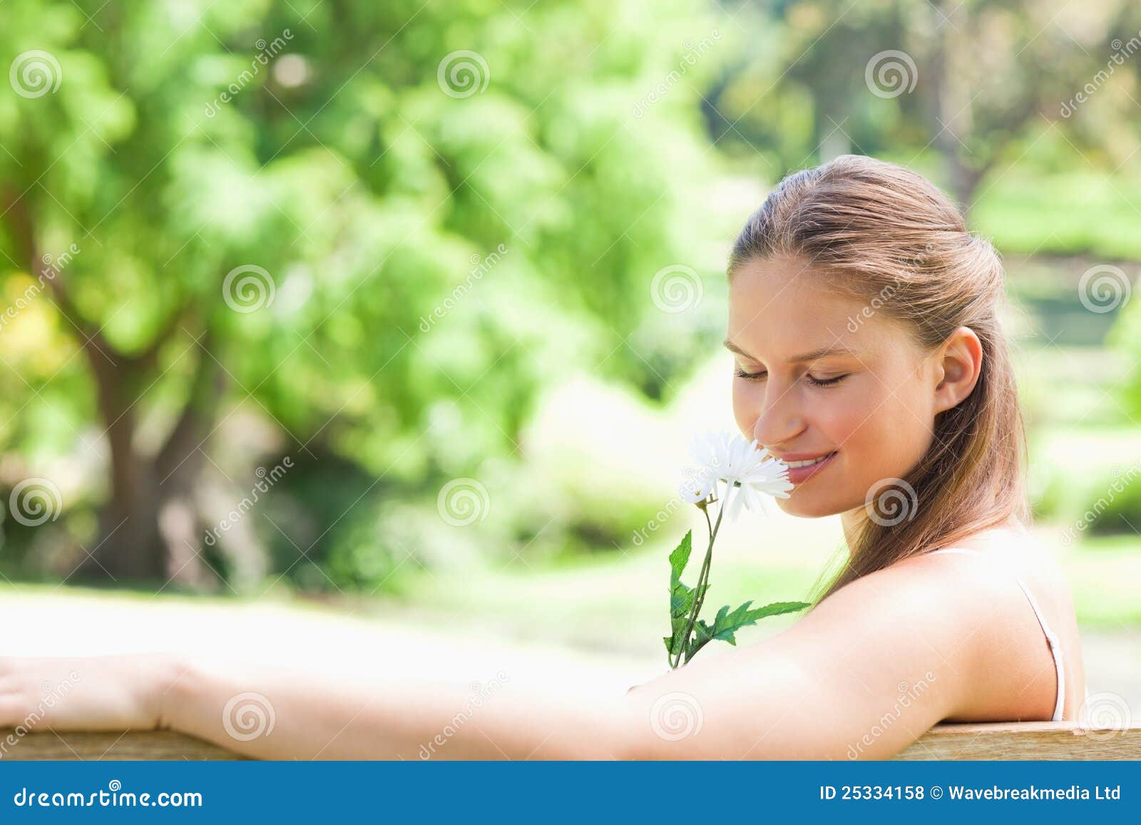 Side View of a Woman Smelling a Flower Stock Photo - Image of beautiful ...