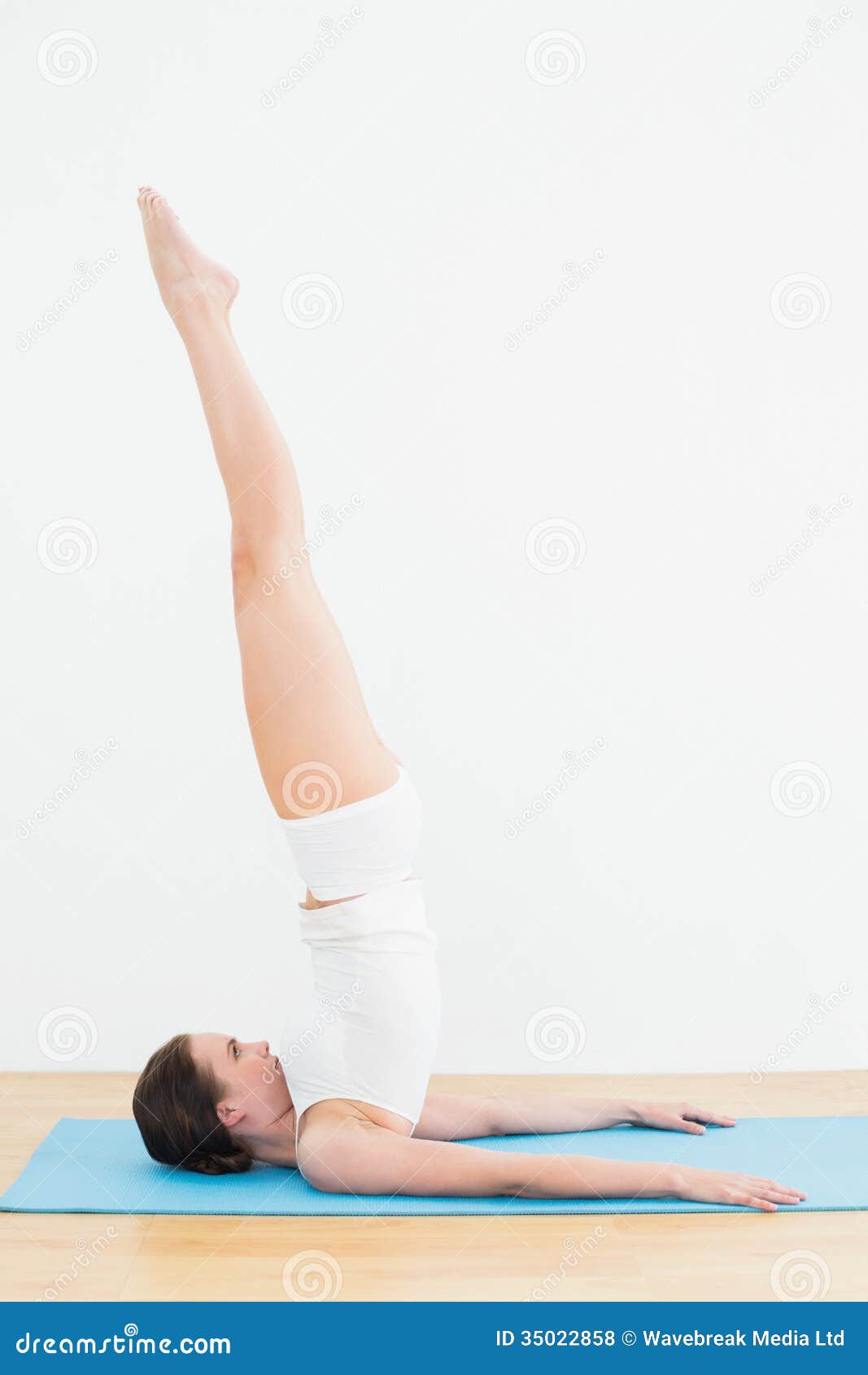 Side View of a Woman Stretching Legs on Exercise Mat Stock Photo ...
