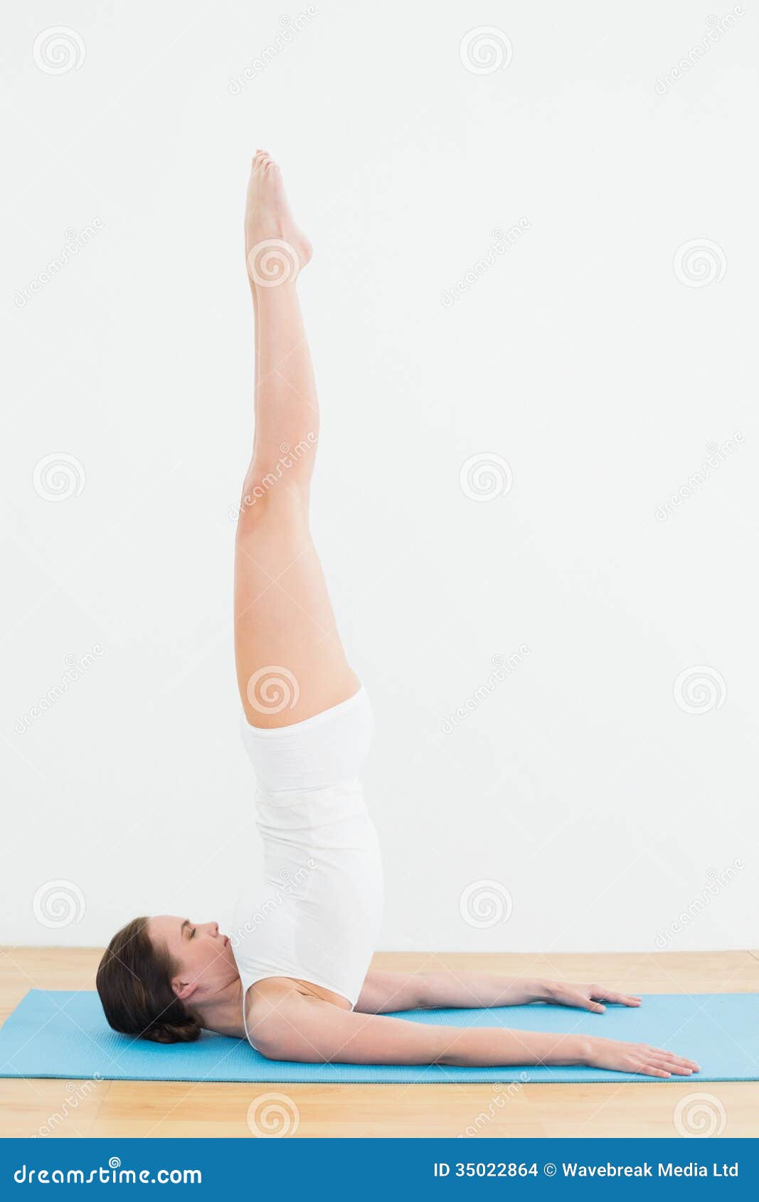 Side View of a Woman Stretching Legs on Exercise Mat Stock Photo ...