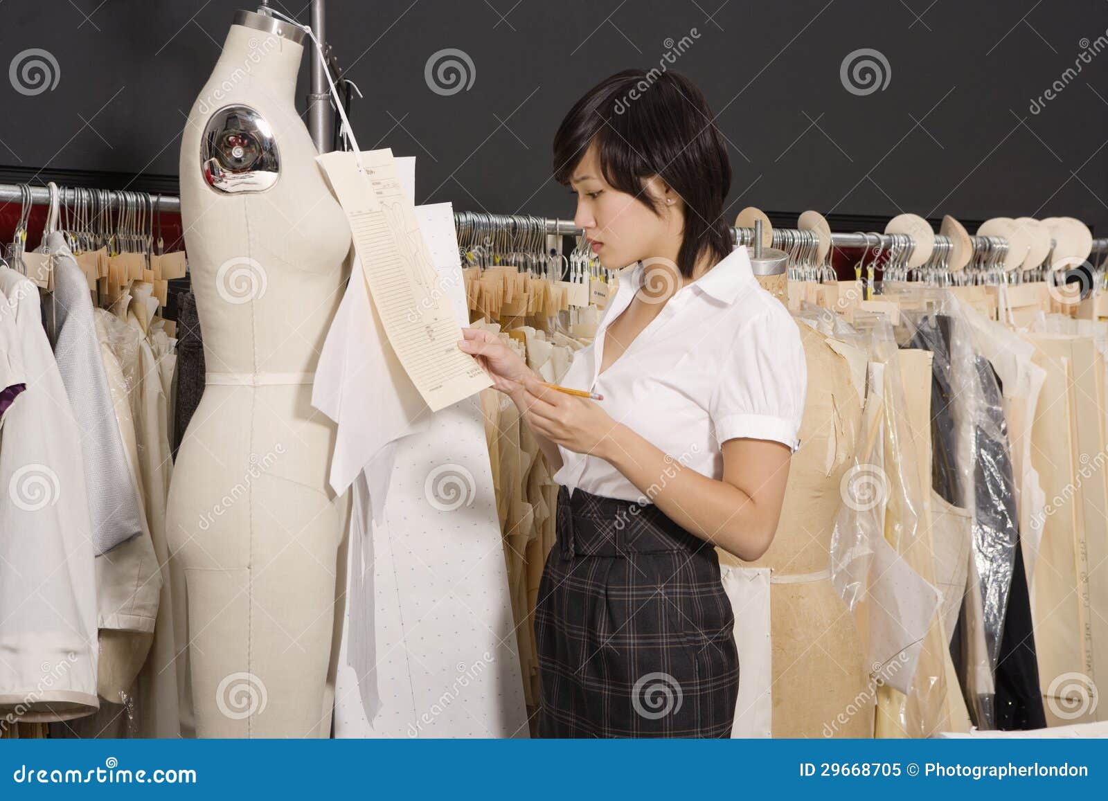 Side View of Woman Working in Her Clothing Store Stock Image - Image of ...