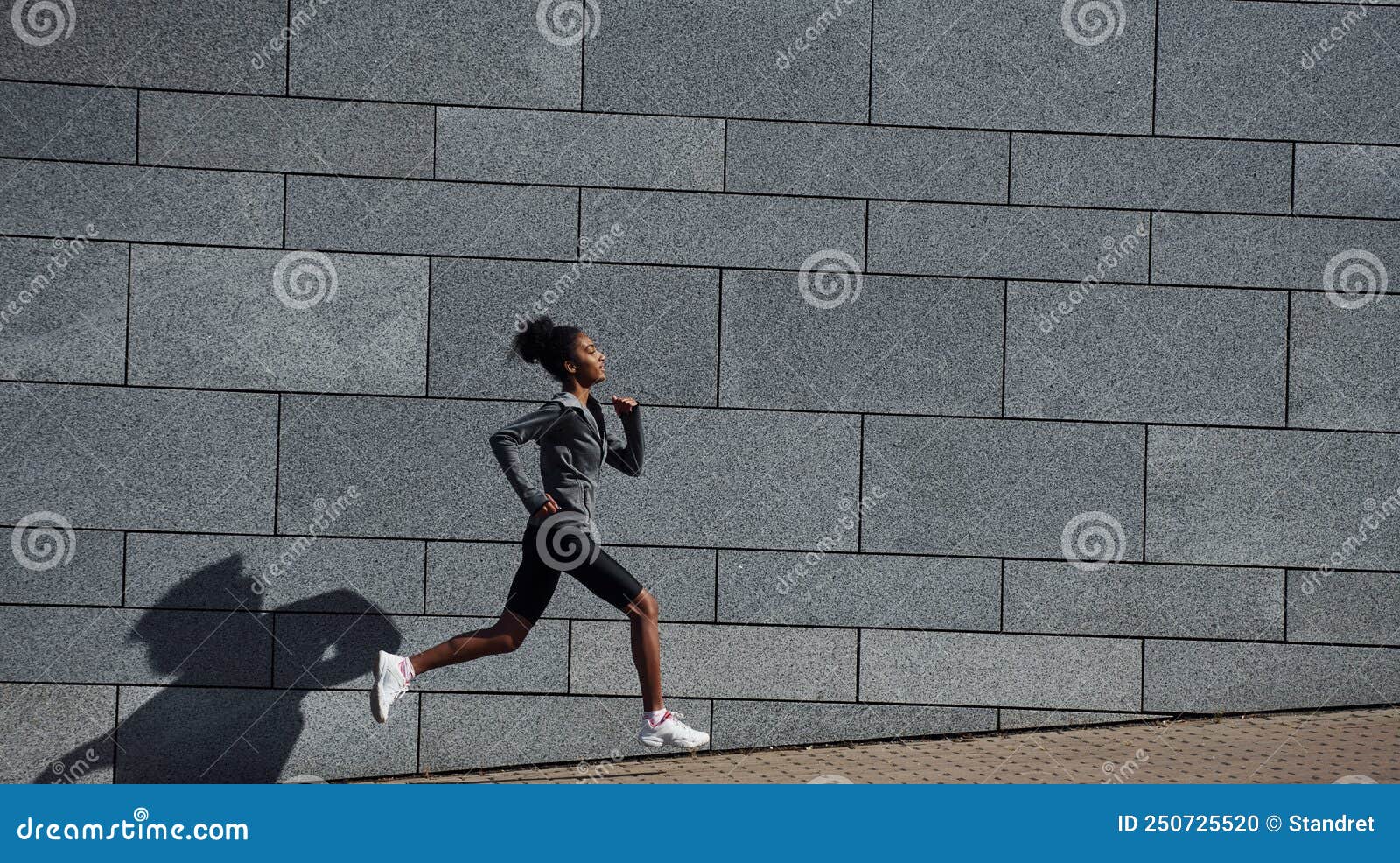 Side View of Young African American Woman in Sportive Clothes that Runs ... Side View of Young African American Woman in Sportive Clothes that Runs ...