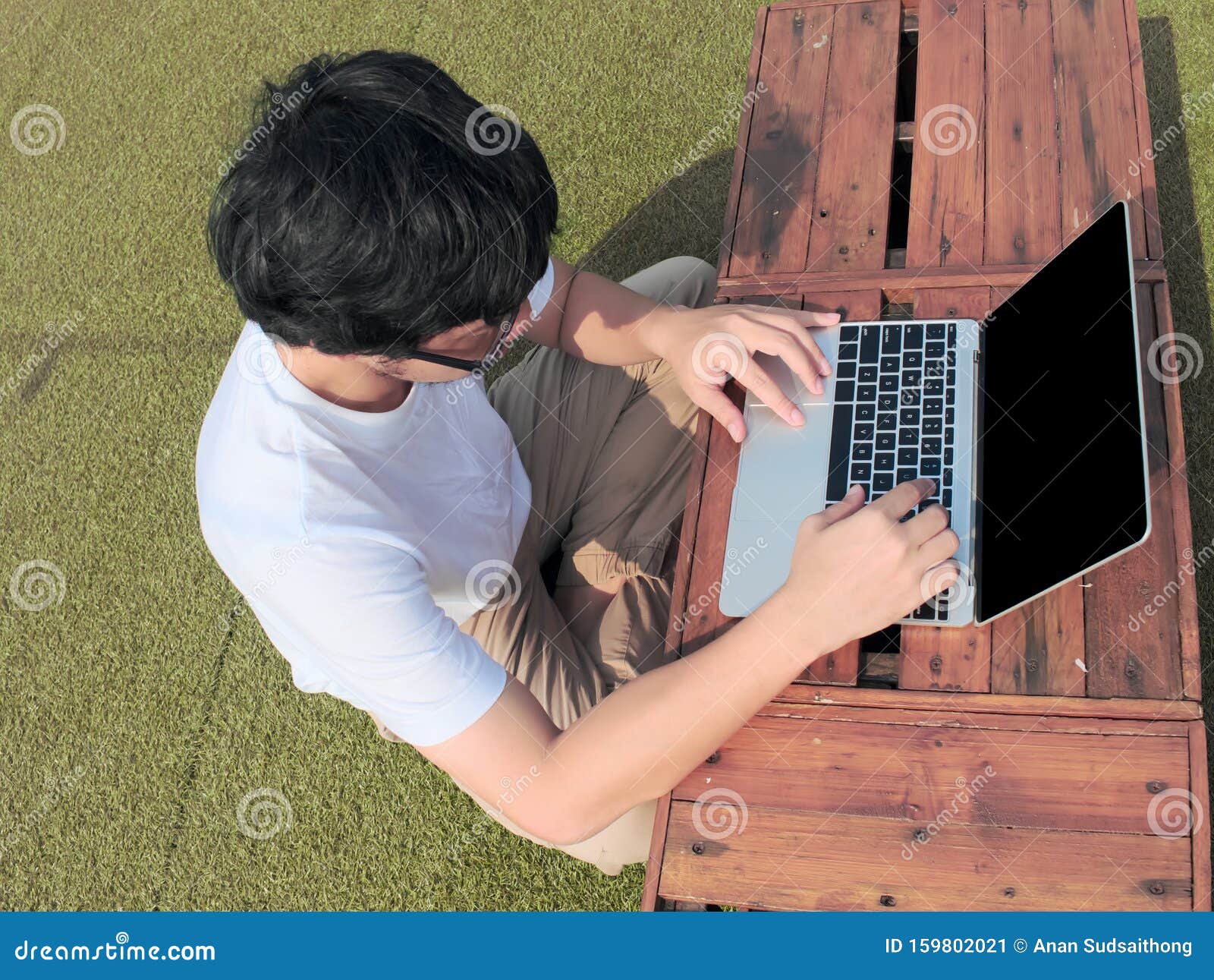 Side View of Young Asian Man Using Computer Laptop at Outdoors ...