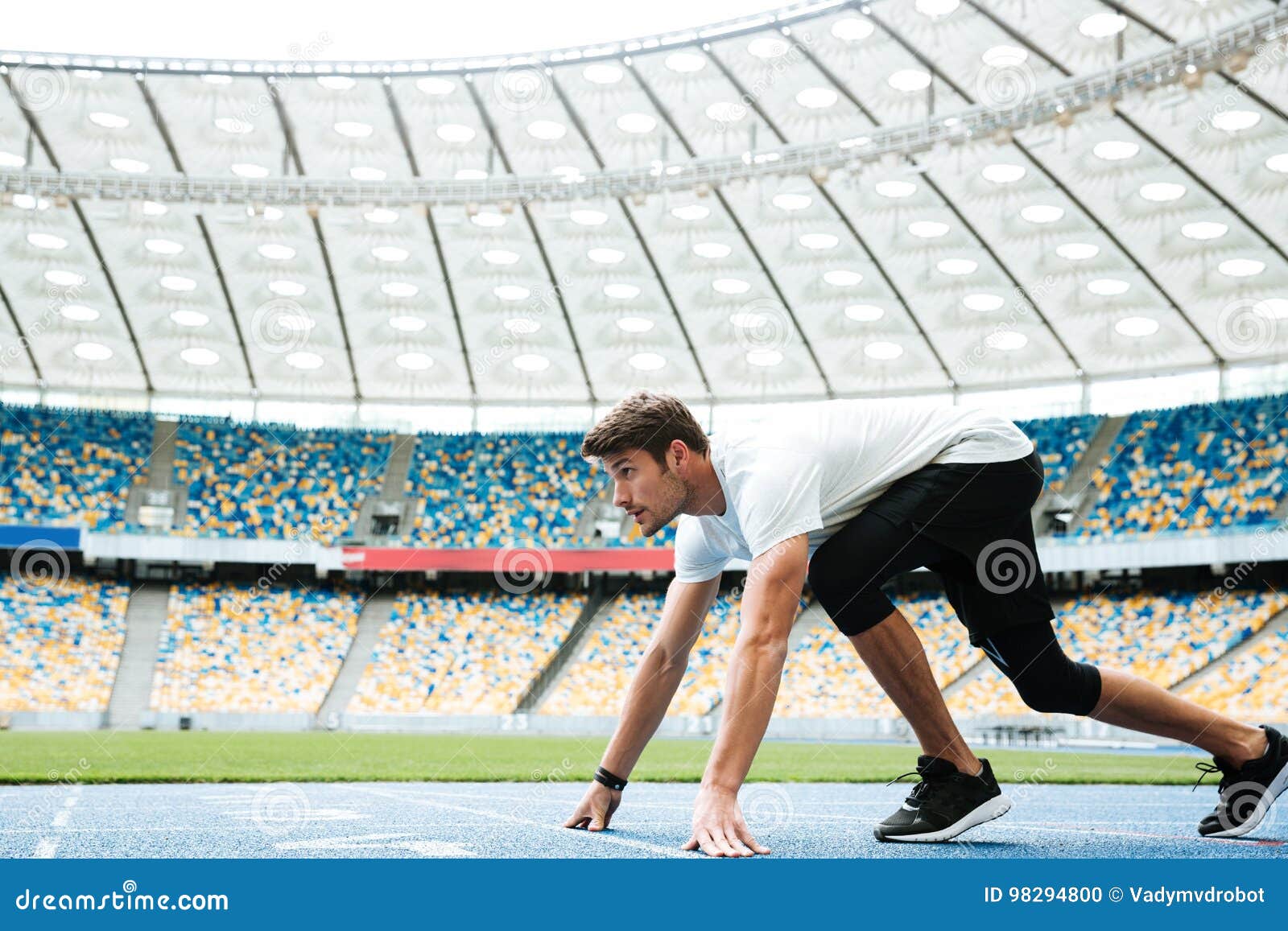 Side View of a Young Athlete at Starting Position Stock Photo - Image ...