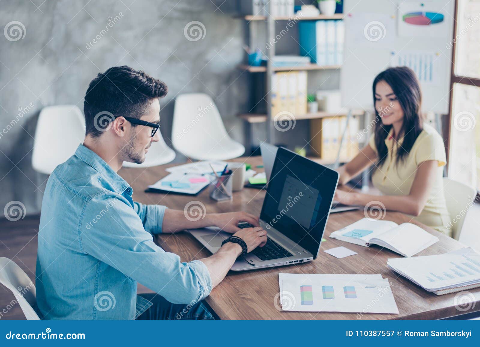Side View of Young Bearded Man in Spectacles Using Computer for Stock ...