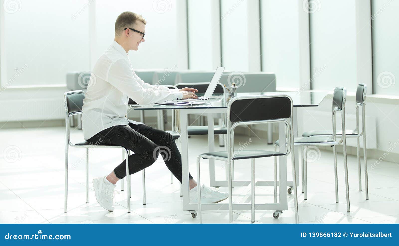 Side View. Young Businessman Typing on Laptop Stock Photo - Image of ...