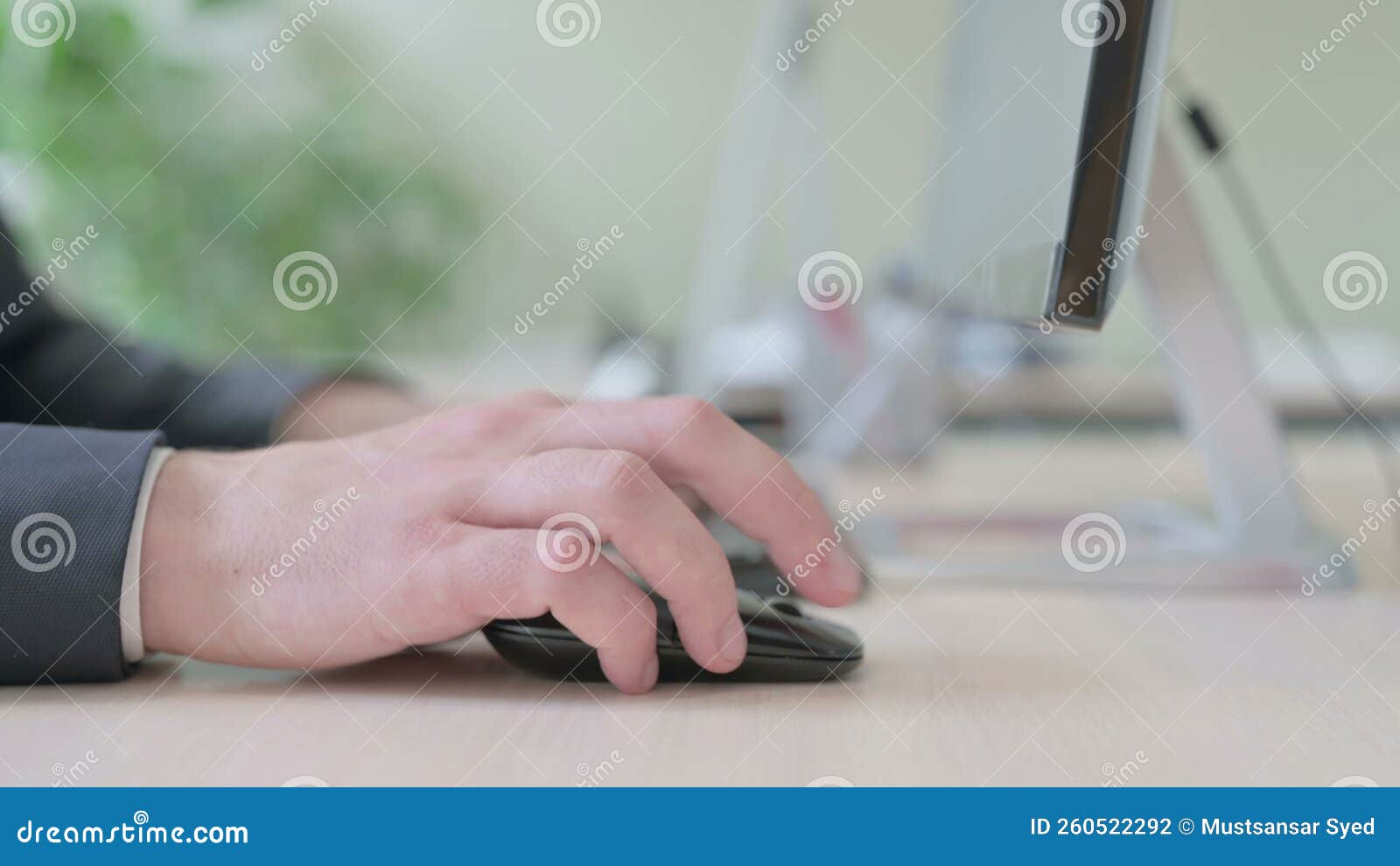 Side View of Businessman Using Mouse and Typing on Desktop Keyboard ...