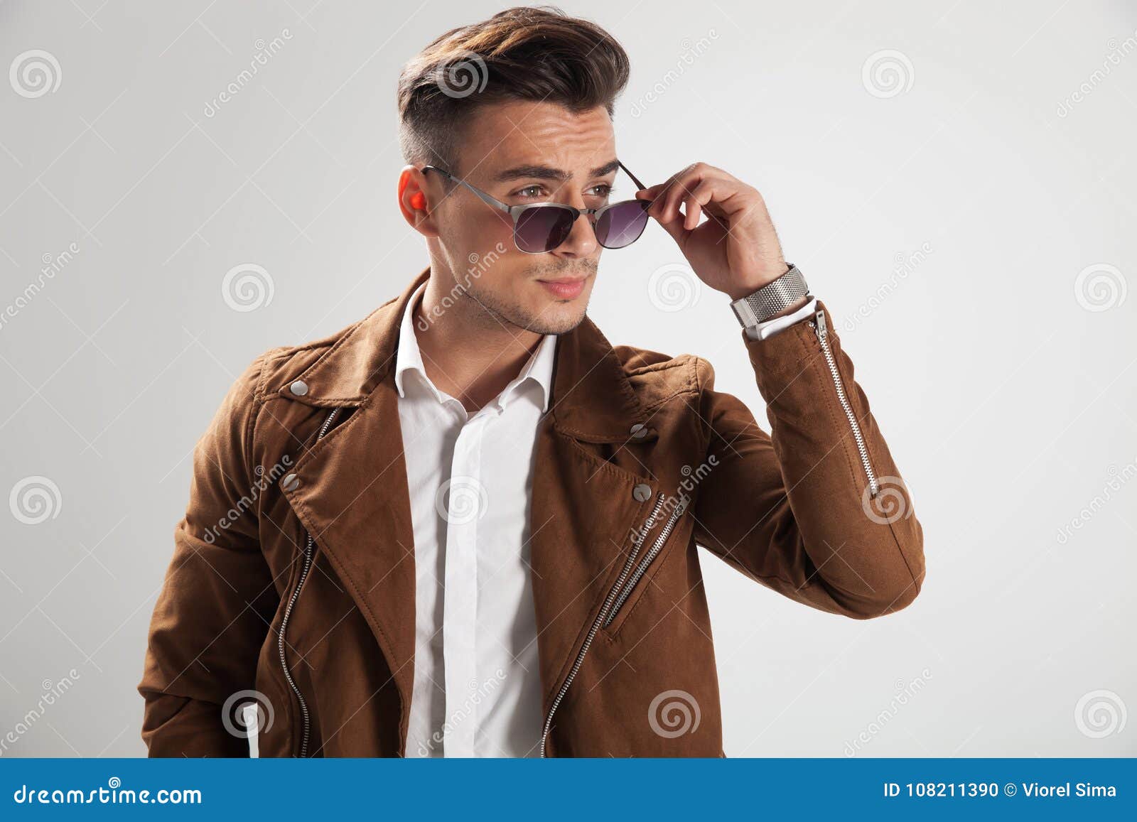Young Casual Man Putting on His Sunglasses Stock Photo - Image of ... Young Casual Man Putting on His Sunglasses Stock Photo - Image of ...