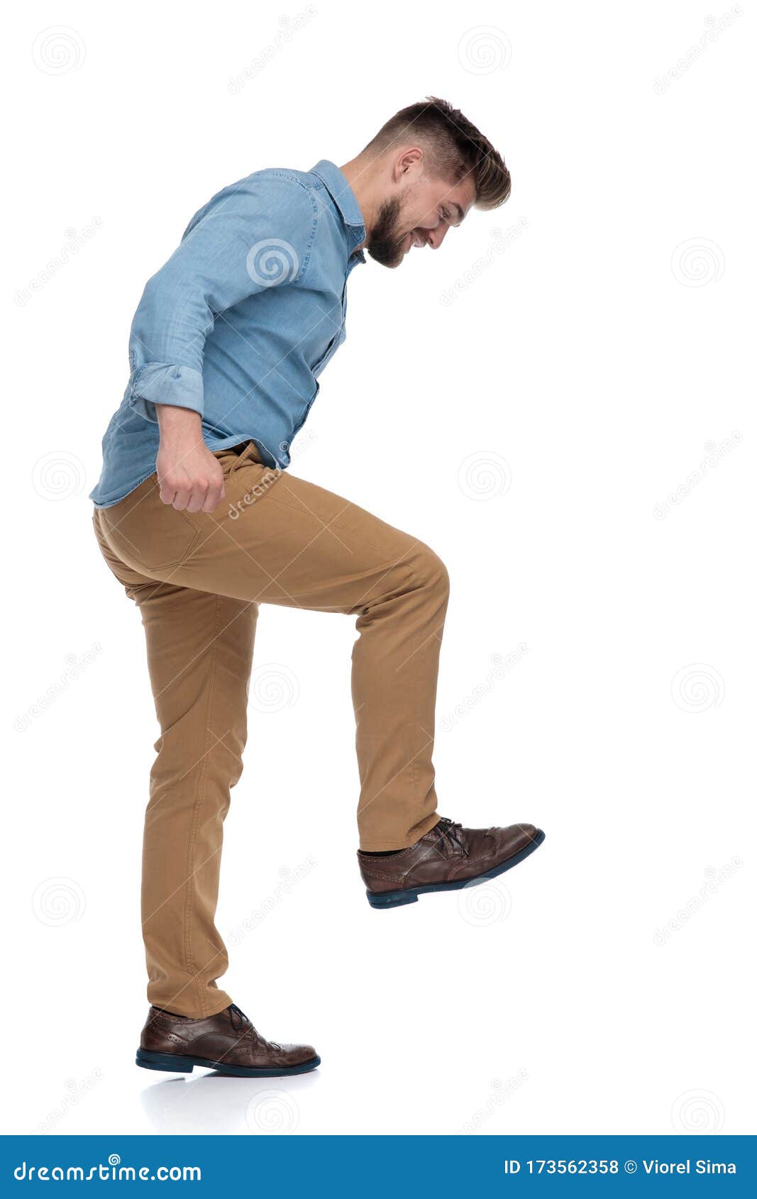 Side View of a Young Casual Man Stepping and Laughing Stock Photo ... Side View of a Young Casual Man Stepping and Laughing Stock Photo ...