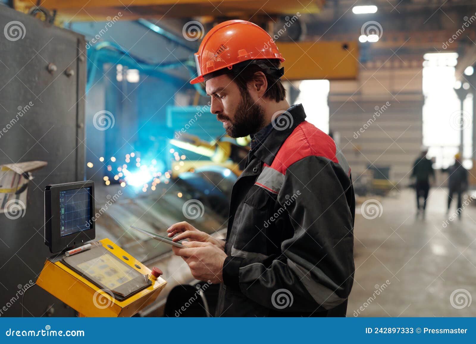 Side View of Young Engineer in Workwear Using Digital Tablet Stock ...