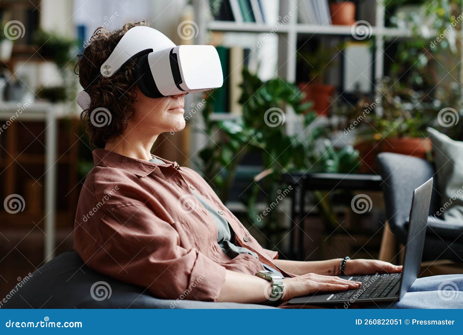 Side View of Young Female Programmer in Vr Headset Using Laptop Stock ... Side View of Young Female Programmer in Vr Headset Using Laptop Stock ...