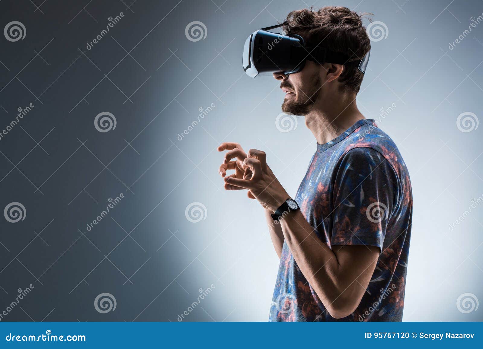 Side View of a Young Guy Using a VR Headset. Emotions Stock Photo ...