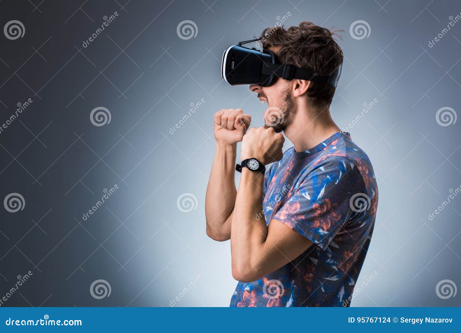 Side View of a Young Guy Using a VR Headset. Emotions Stock Photo ...
