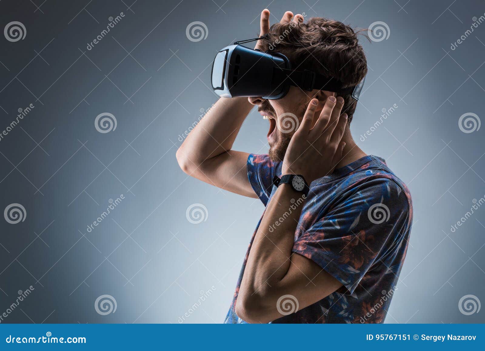 Side View of a Young Guy Using a VR Headset. Emotions Stock Image ...