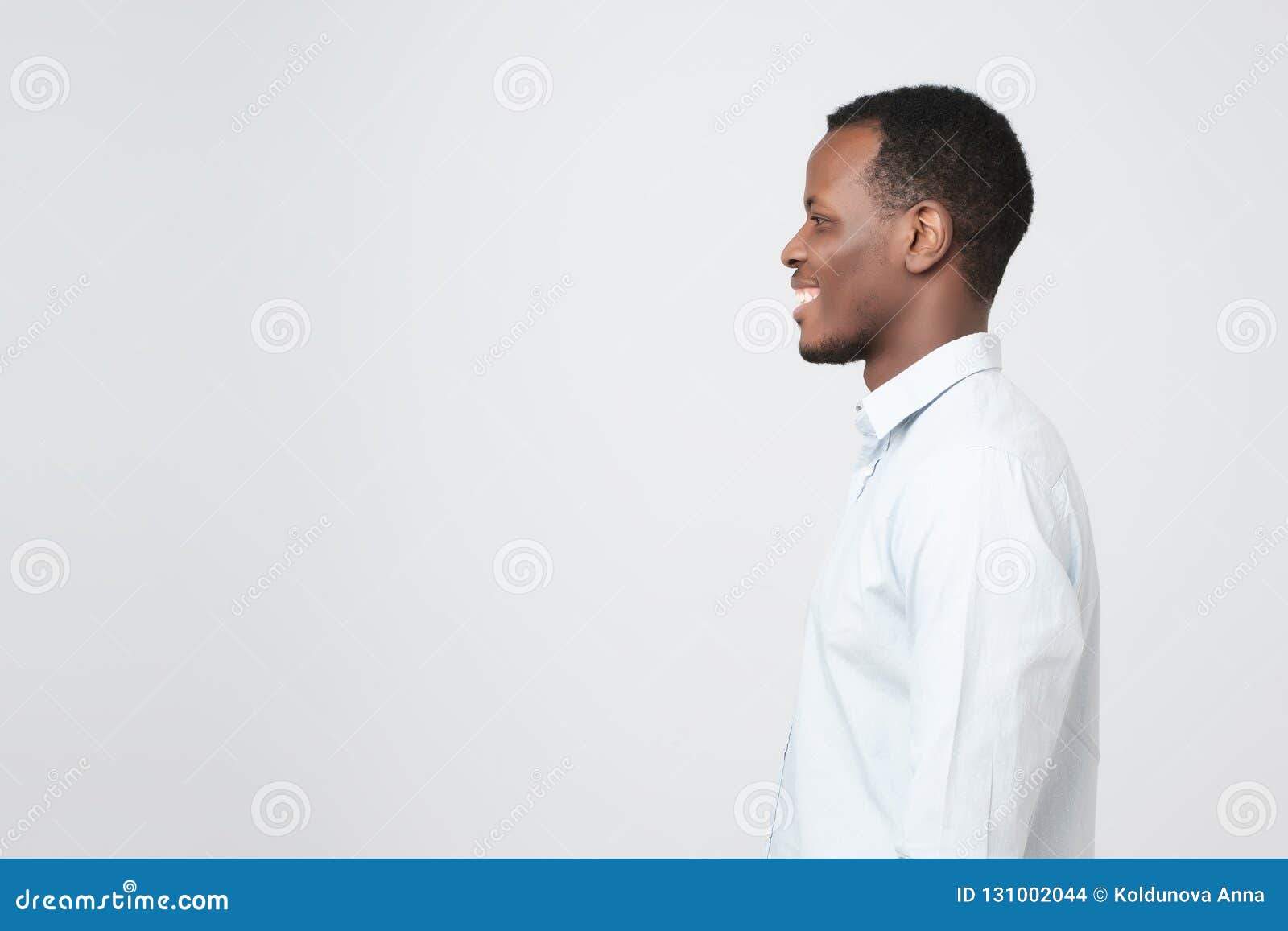 Side View of Young Happy African Smiling Man Stock Photo - Image of ...