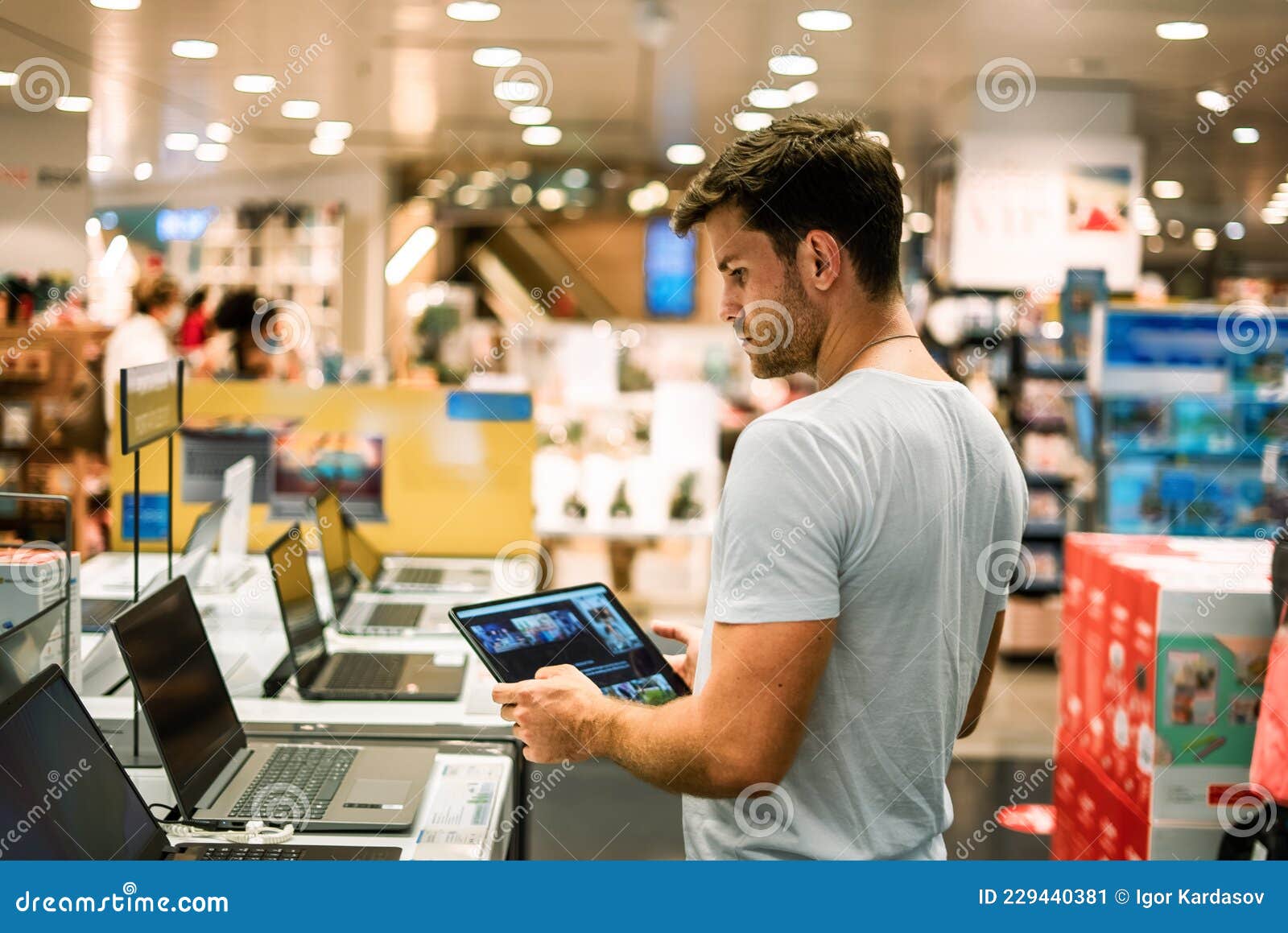 Client Choosing Laptop in Store Stock Image - Image of decision, trendy ...