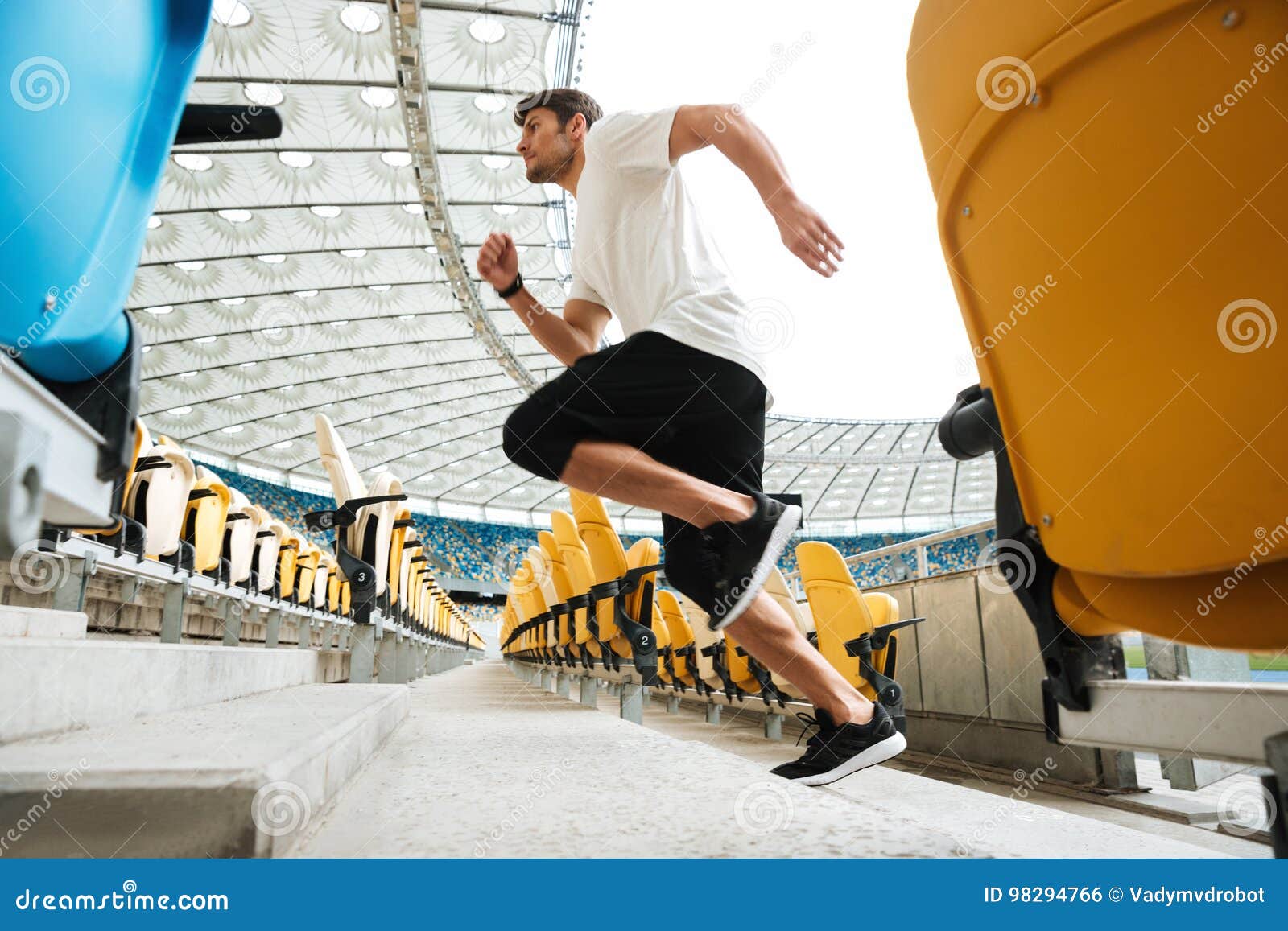 Side View of a Young Male Runner Running Upstairs Stock Photo - Image ...