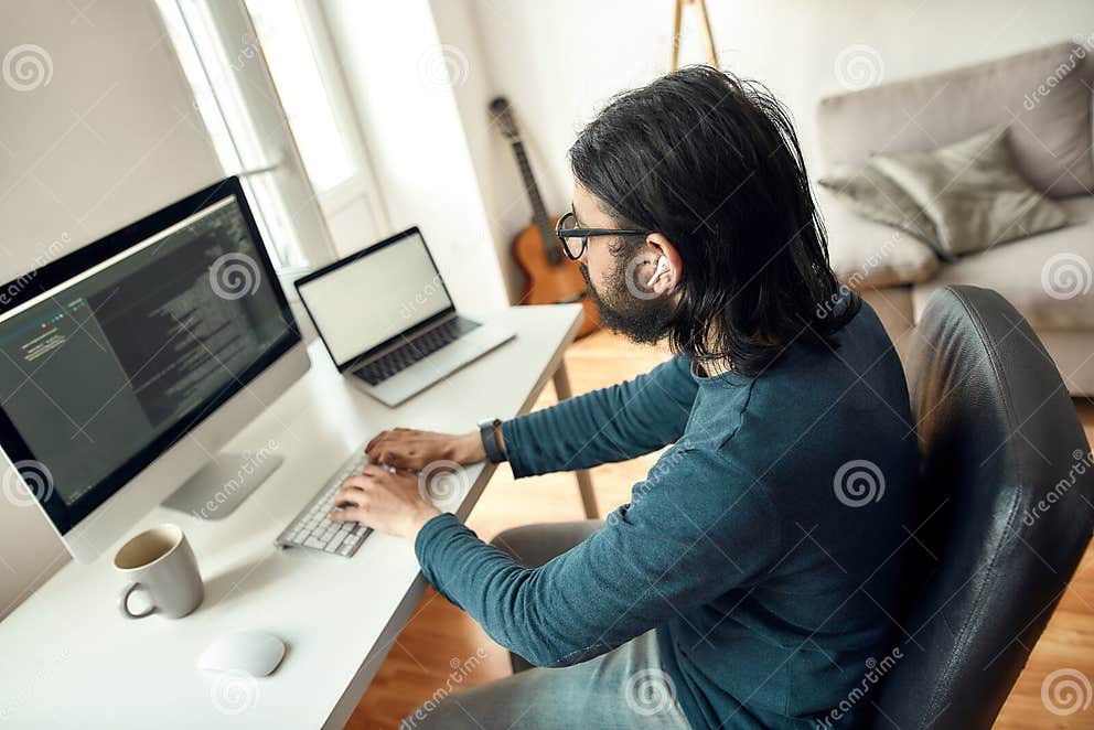 Side View of Young Male Web Developer Wearing Eyeglasses Writing Code ...