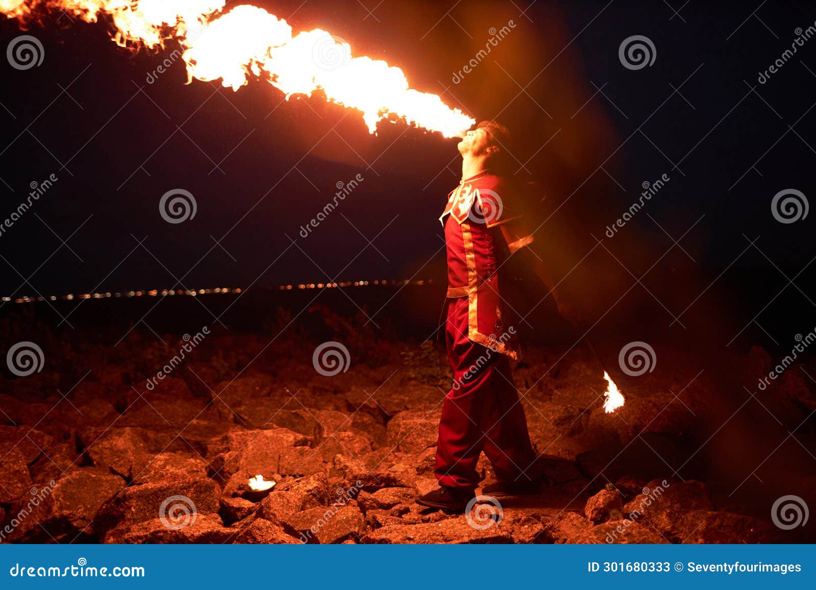 Side View of Young Man Breathing Fire Stock Image - Image of artist ...