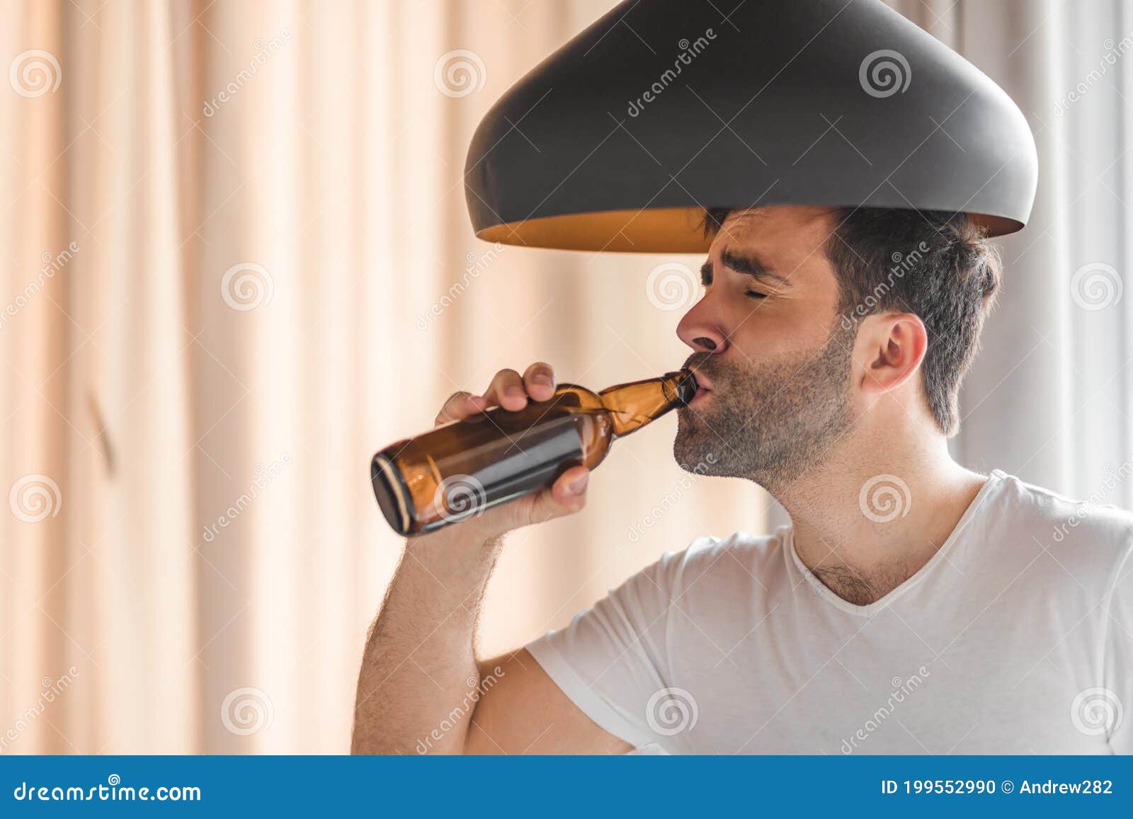Side View of Young Man Drinking Cool Beer from the Bottle. Stock Photo ...