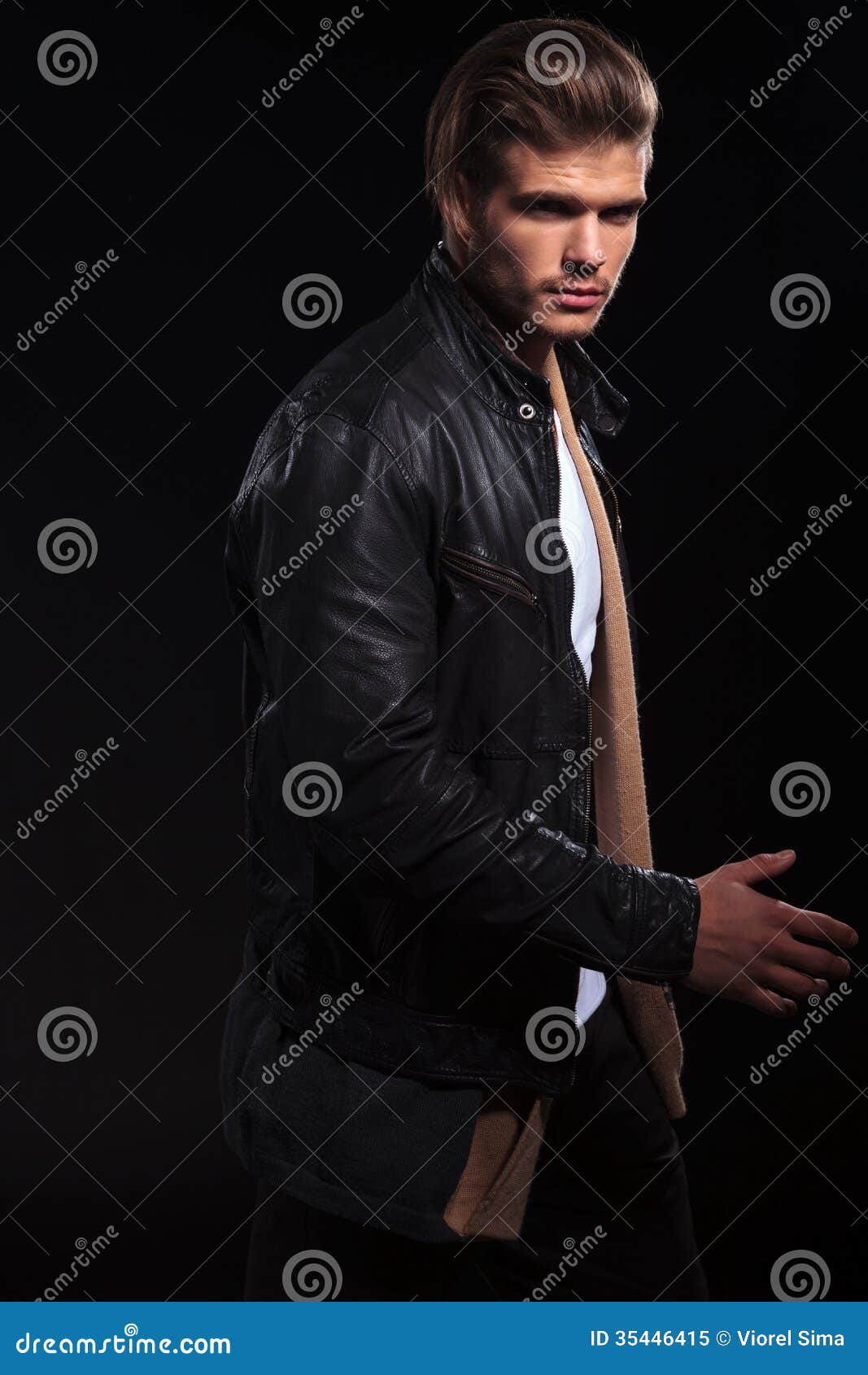 Side View of a Young Man in Leather Jacket is Walking Stock Image ...