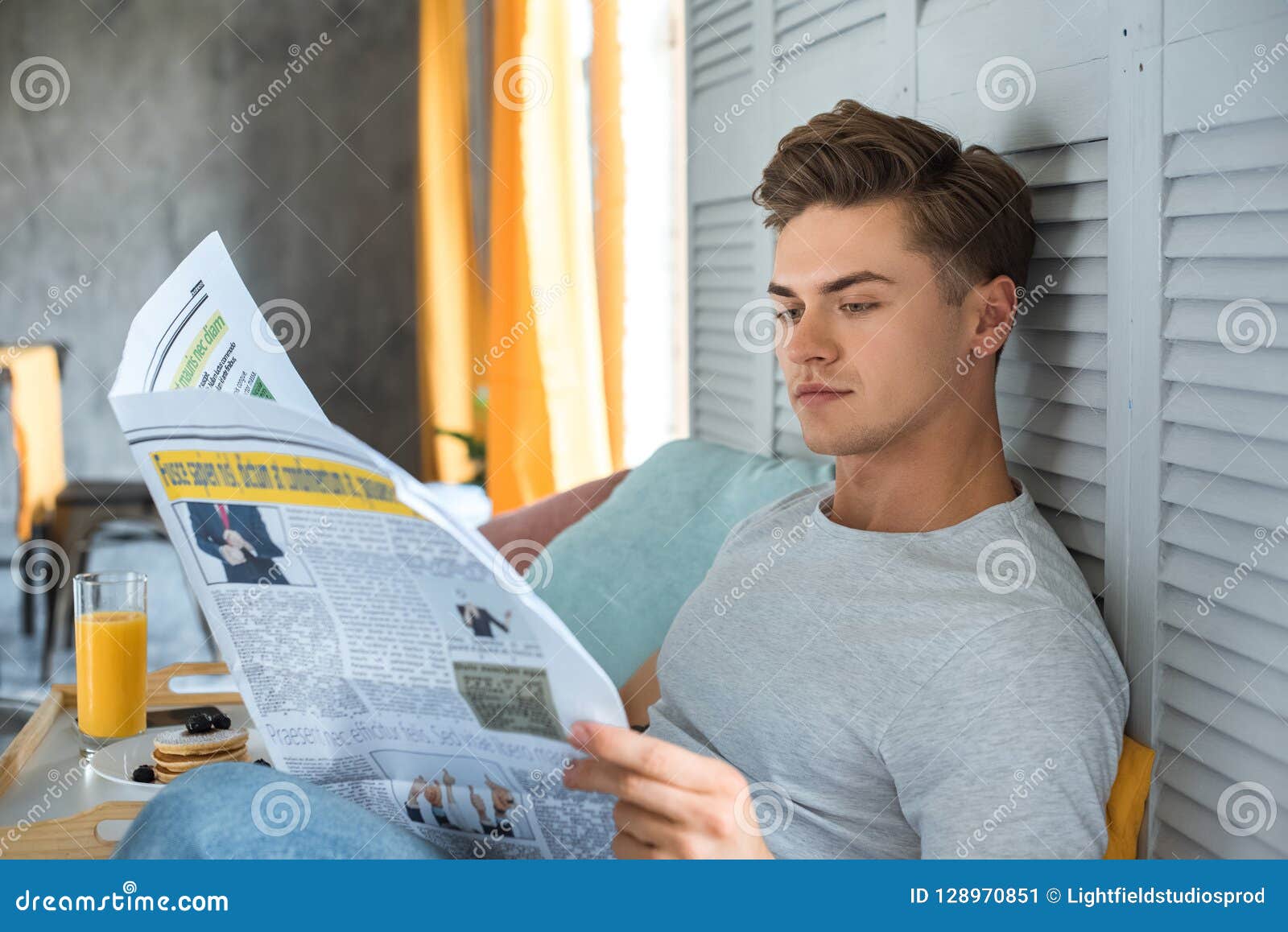 Side view of young man stock image. Image of newspaper - 128970851