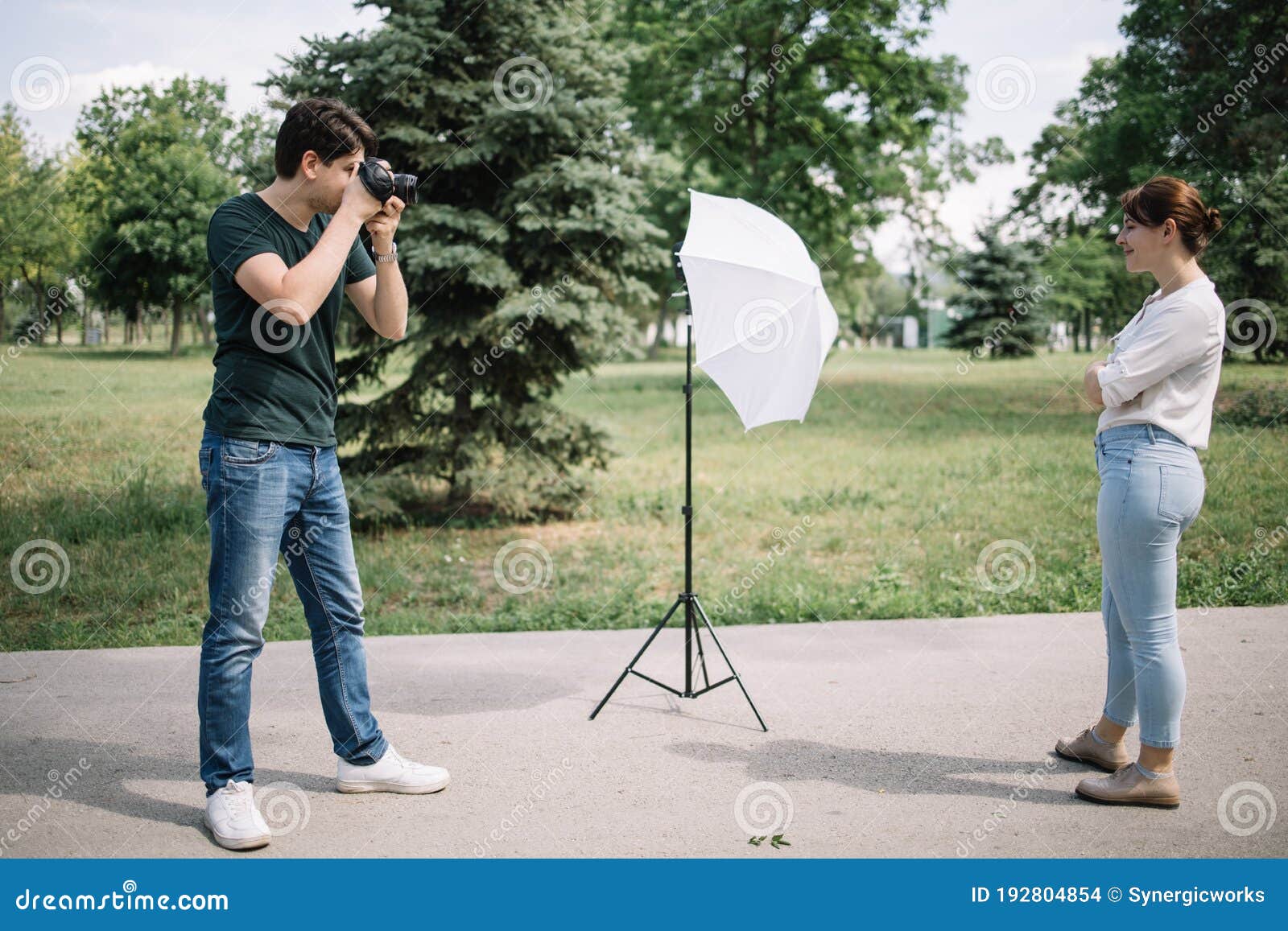 Side View of Young Man Working with Professional Model Stock Photo ...