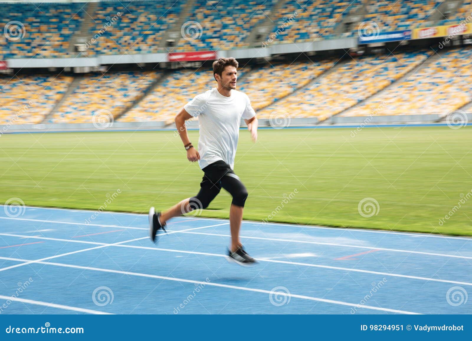 Side View of a Young Professional Sprinter Running Stock Image - Image ...