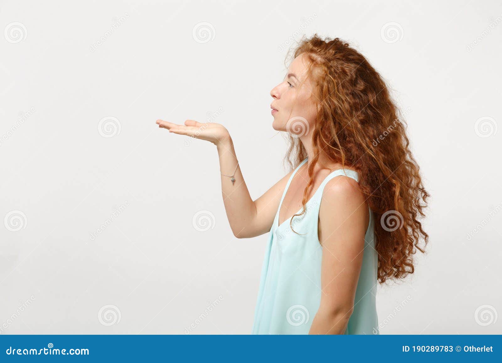 Side View Of Young Redhead Woman Girl In Casual Light Clothes Posing