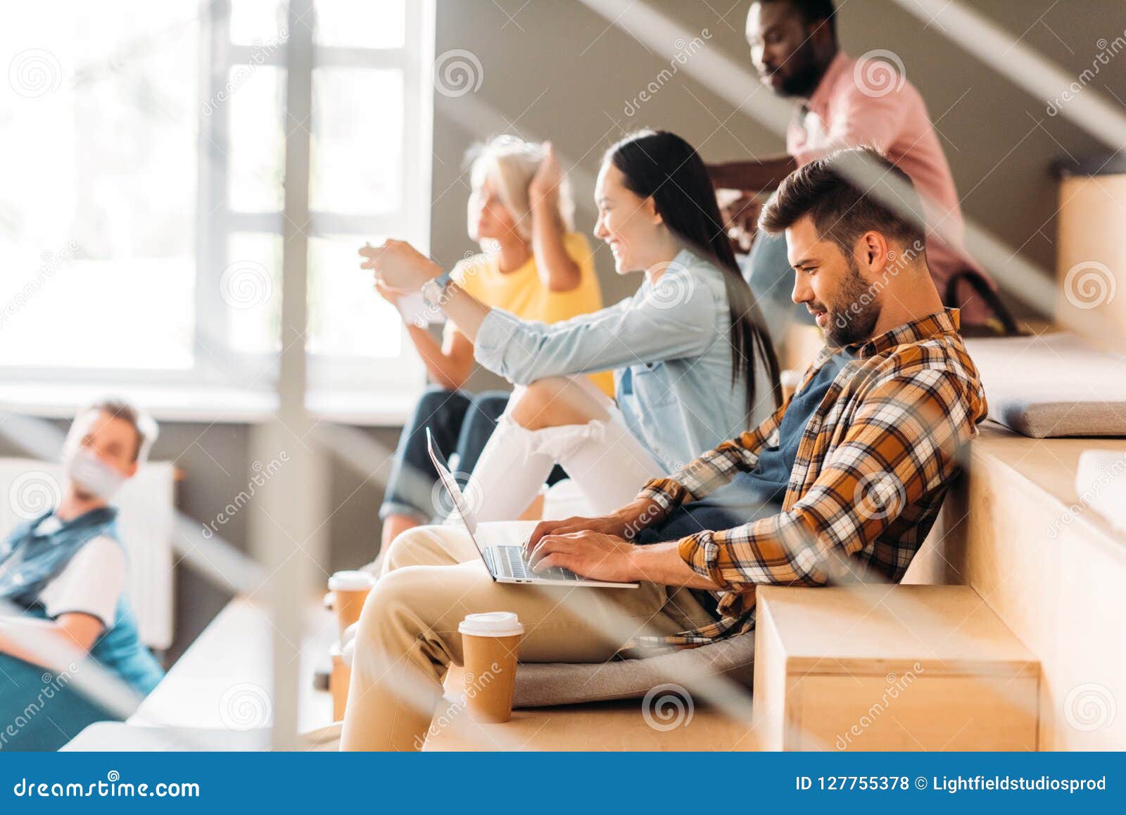 Side View of Young Student Using Laptop while Sitting on Tribunes Stock ...