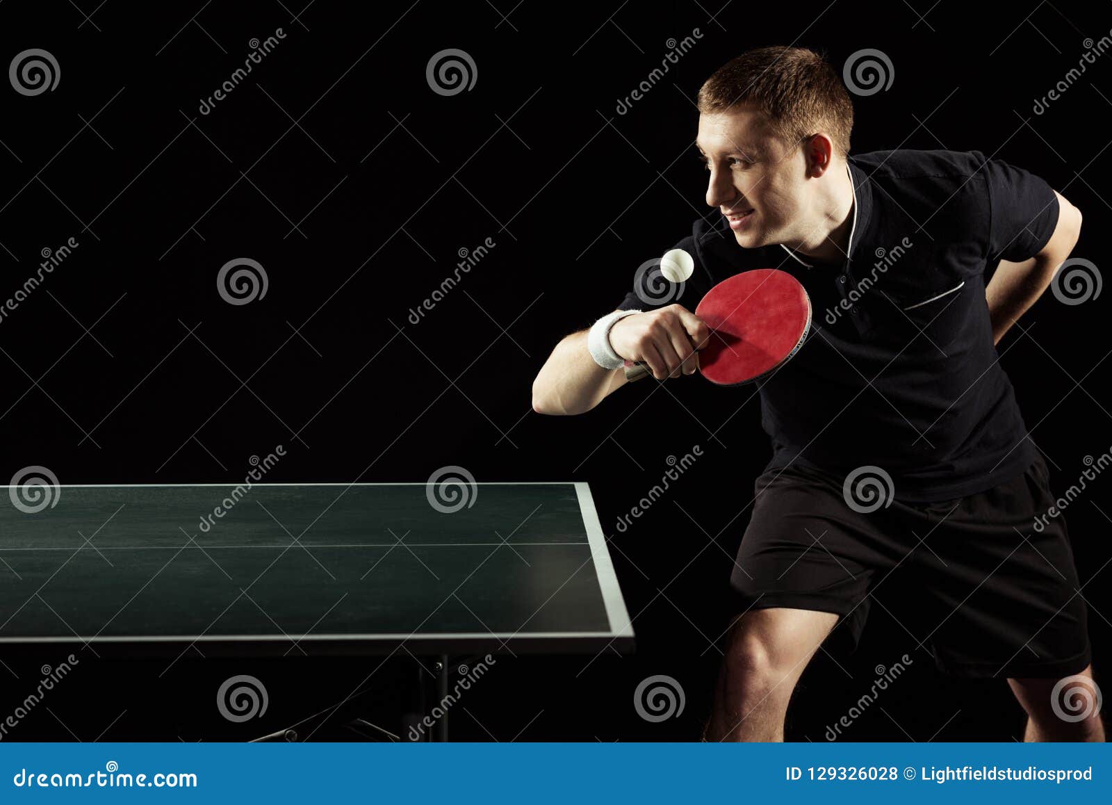 Side View of Young Tennis Player Practicing in Table Tennis Stock Photo ...