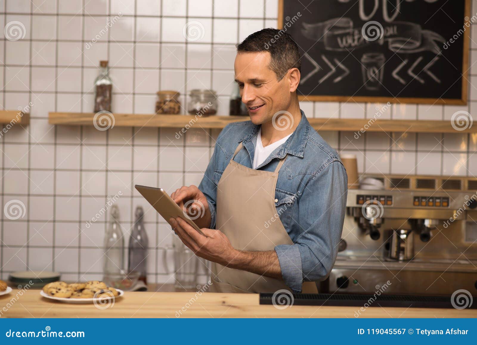 Waiter Using Digital Tablet in Cafe Stock Image - Image of coffee ...