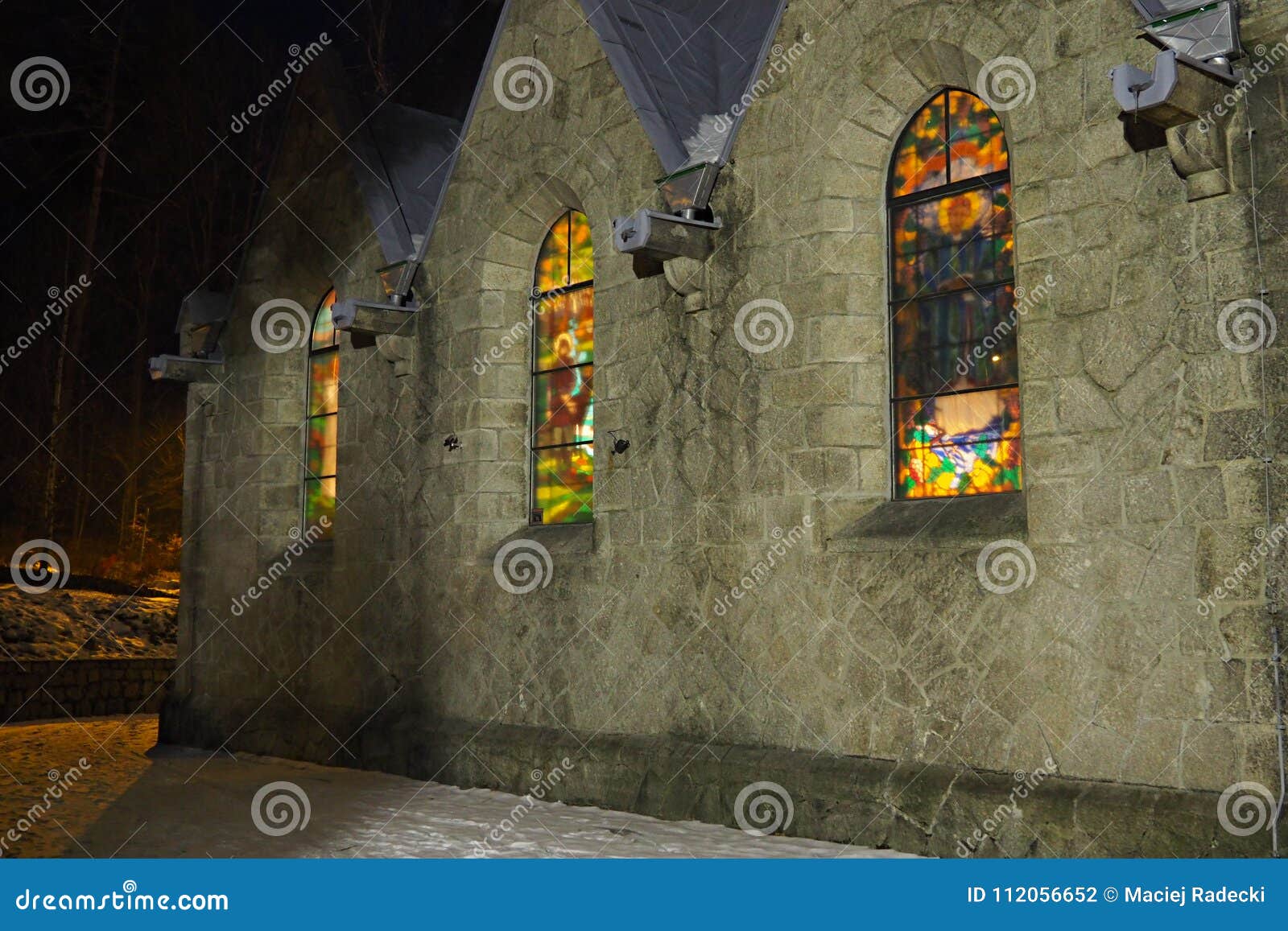Side Wall Of A Stone Church With Stained-glass Windows Royalty-Free ...