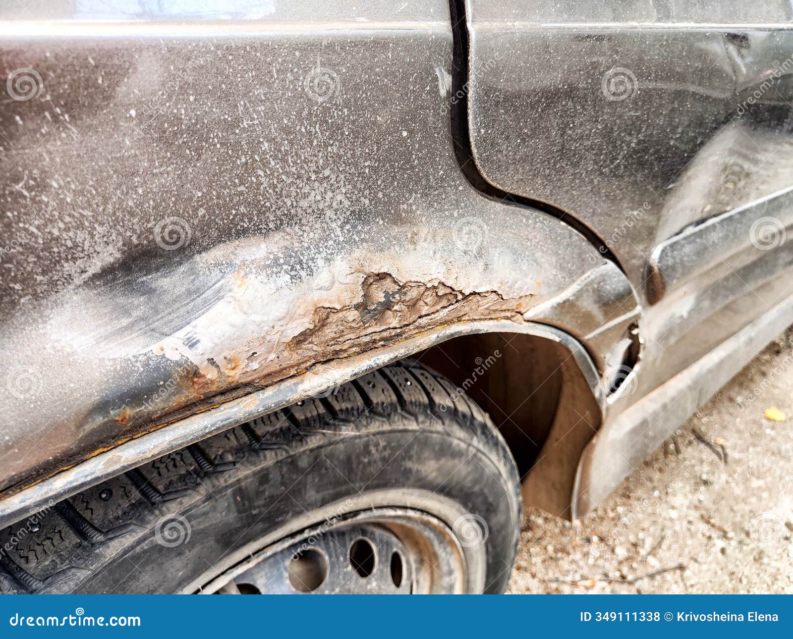The Side of a Weathered Car Shows Significant Rust Damage and Wear ...