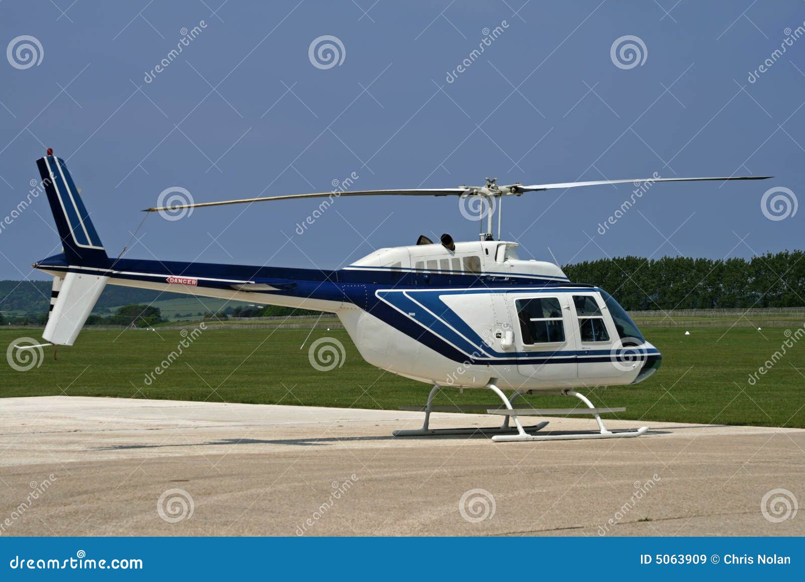 Side of white helicopter stock image. Image of parked - 5063909