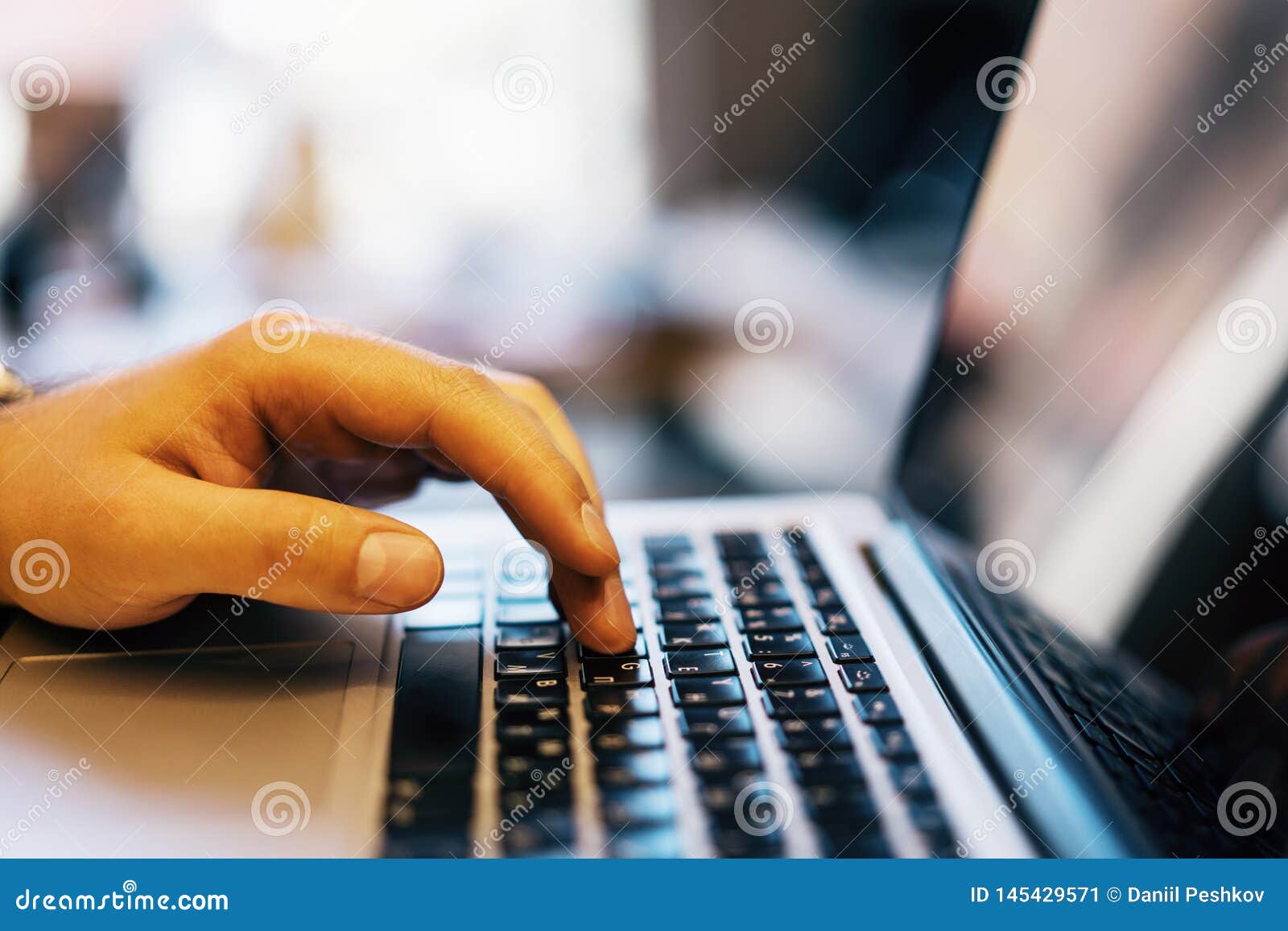 Sideview of Male Using Laptop on Desk Top Stock Image - Image of ...