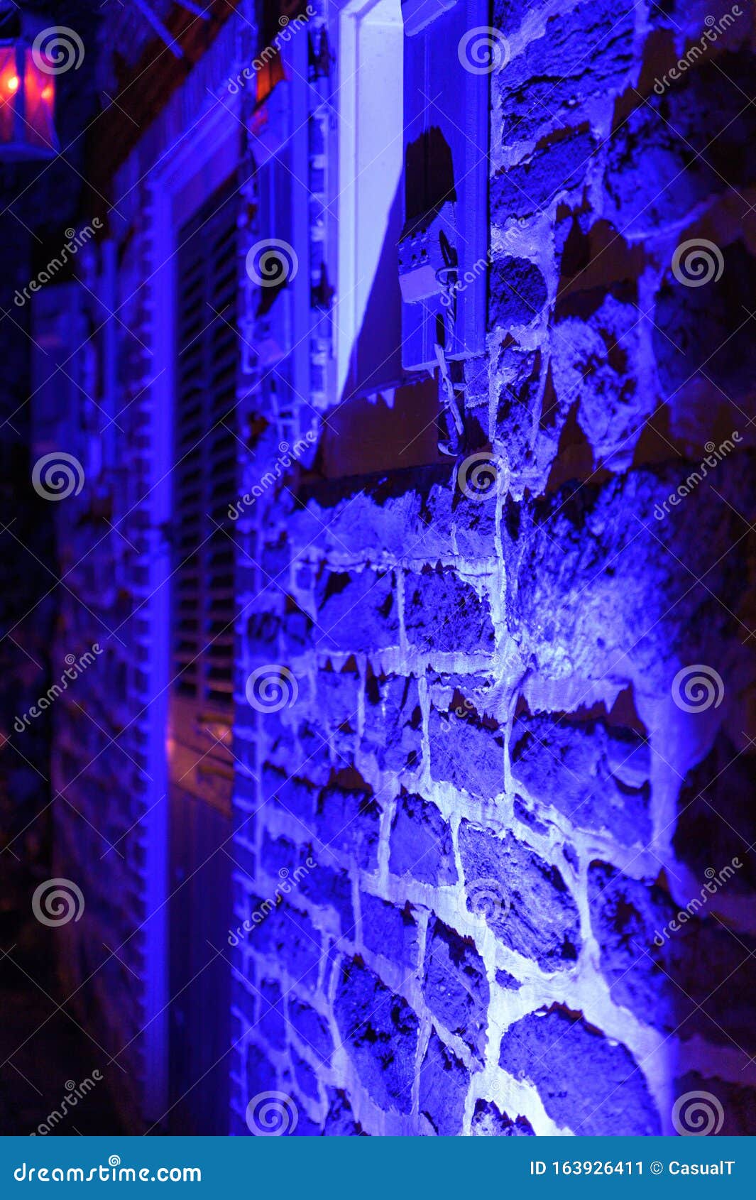 Sideview of an Old-fashioned Brick & Mortar Building Wall at Night ...