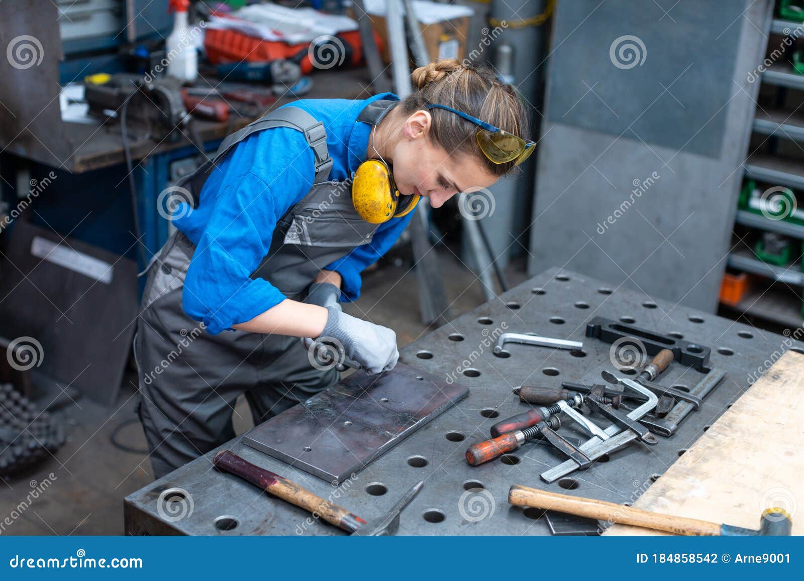 Sideview of Worker Woman Marking Piece of Metal Stock Photo - Image of ...