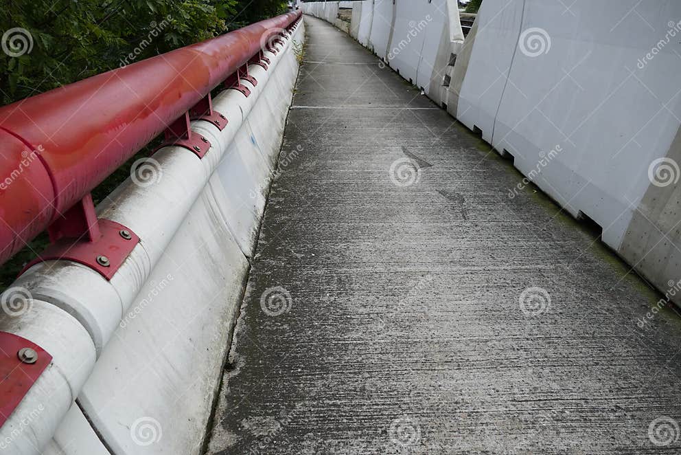 Sidewalk on a Bridge with Red Railing Stock Image - Image of hobbies ...