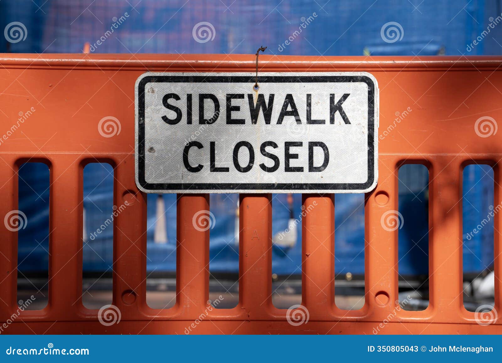 Sidewalk Closed Warning Sign at Construction Zone with Orange Barricade ...