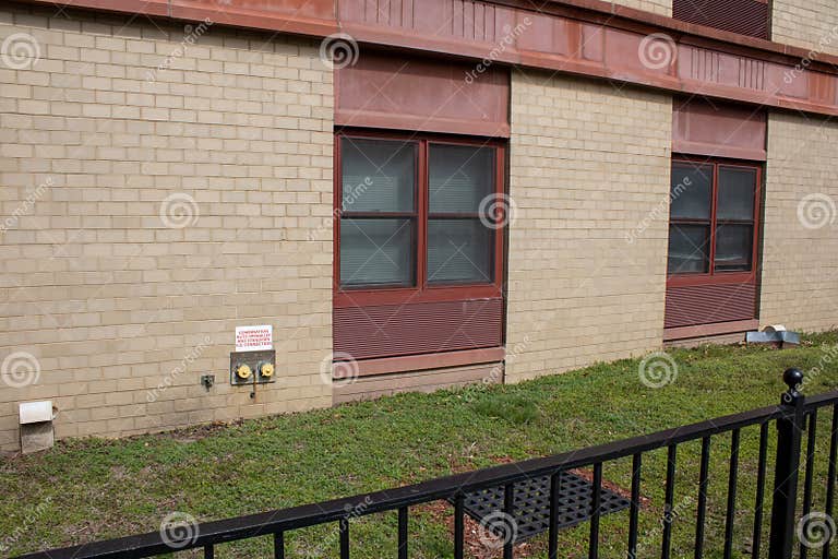 A Sidewalk in Front of a Building and Window with a Sign Editorial ...
