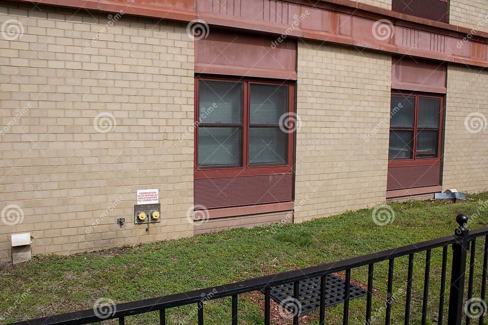 A Sidewalk in Front of a Building and Window with a Sign Editorial ...
