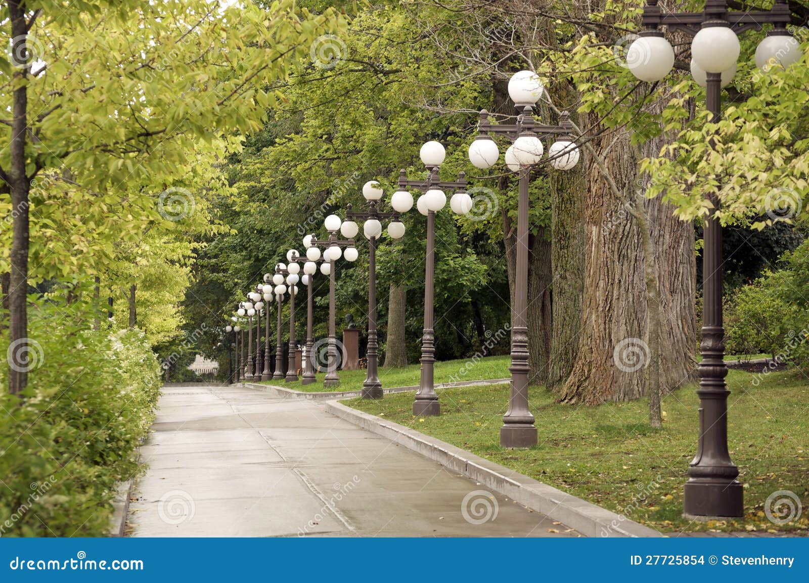 Sidewalk Lined with Trees and Lamps Stock Photo - Image of culture ...