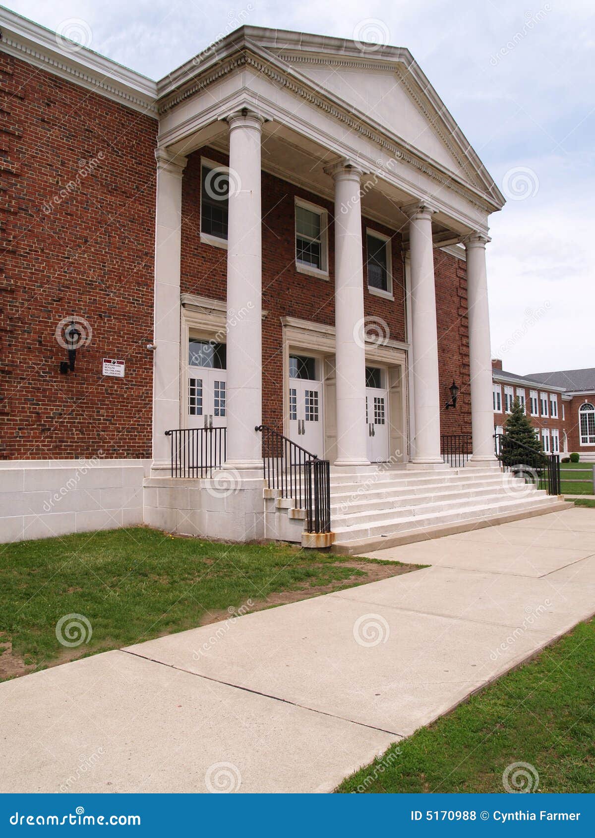 Sidewalk by an Old Brick High School with Columns Stock Photo - Image ...