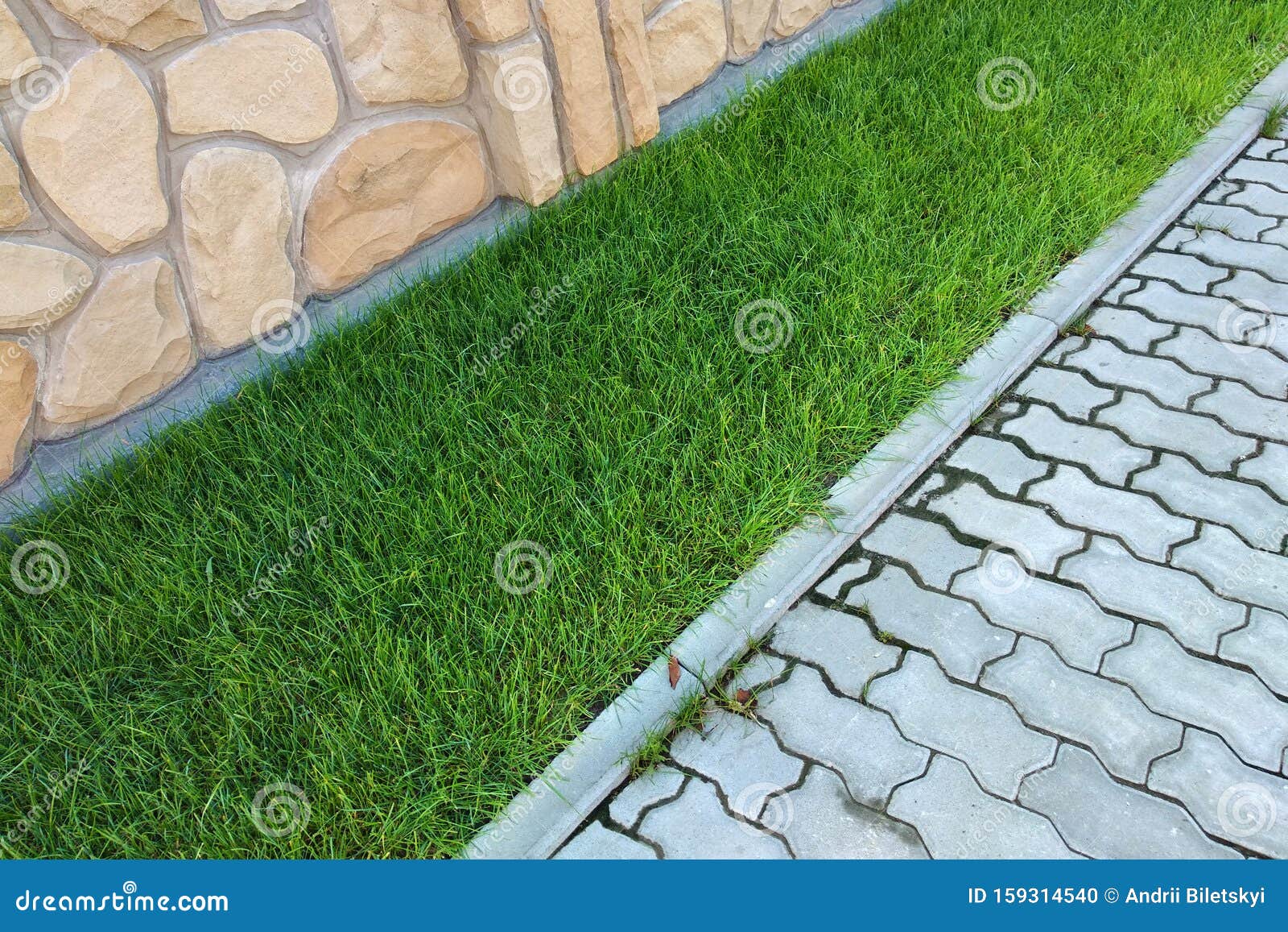 Sidewalk Paved With Round Stone, Rock Or Concrete Slabs Of Various ...